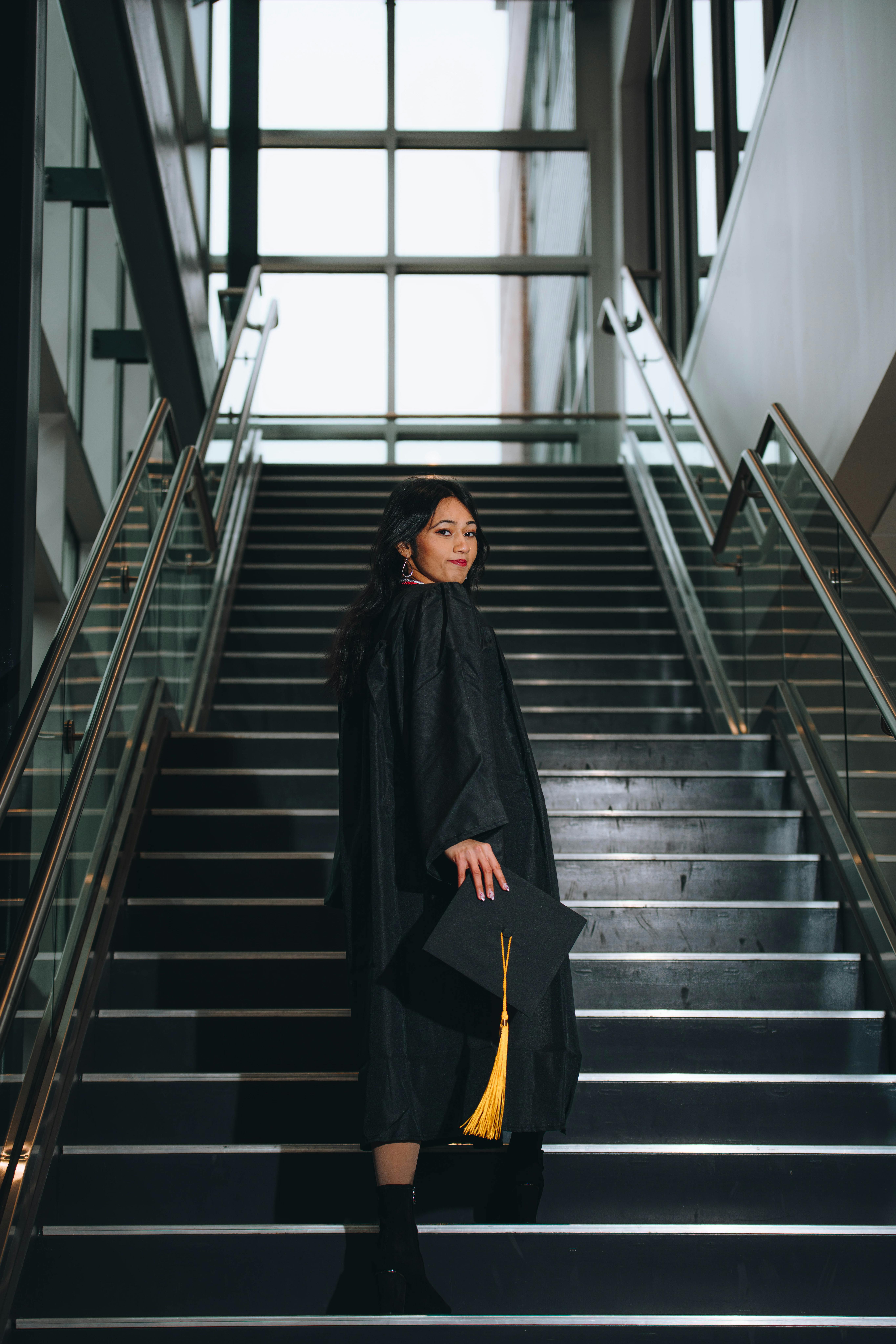 Graduation Portrait on Modern Staircase · Free Stock Photo