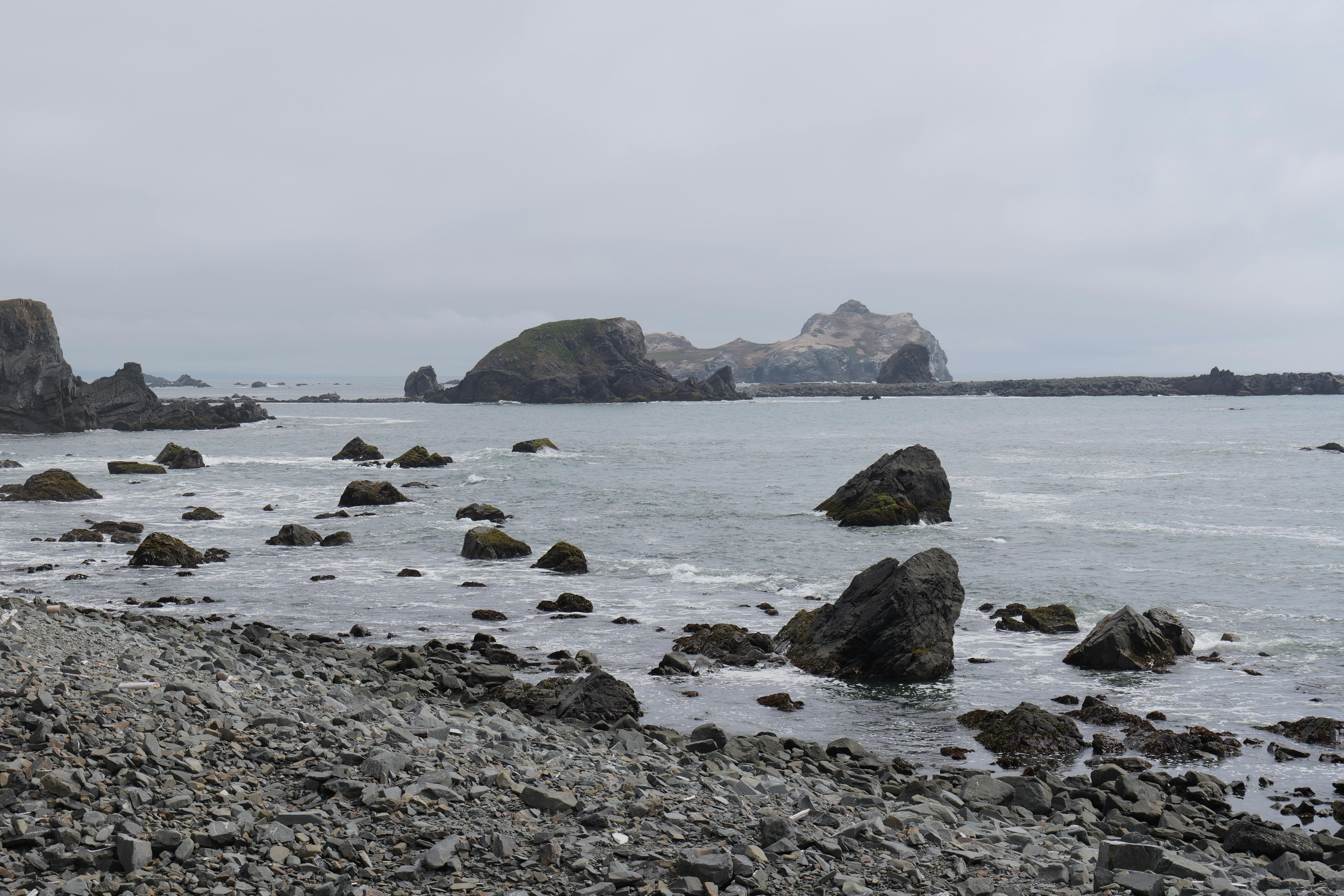 Serene Rocky Ocean Shoreline Landscape · Free Stock Photo