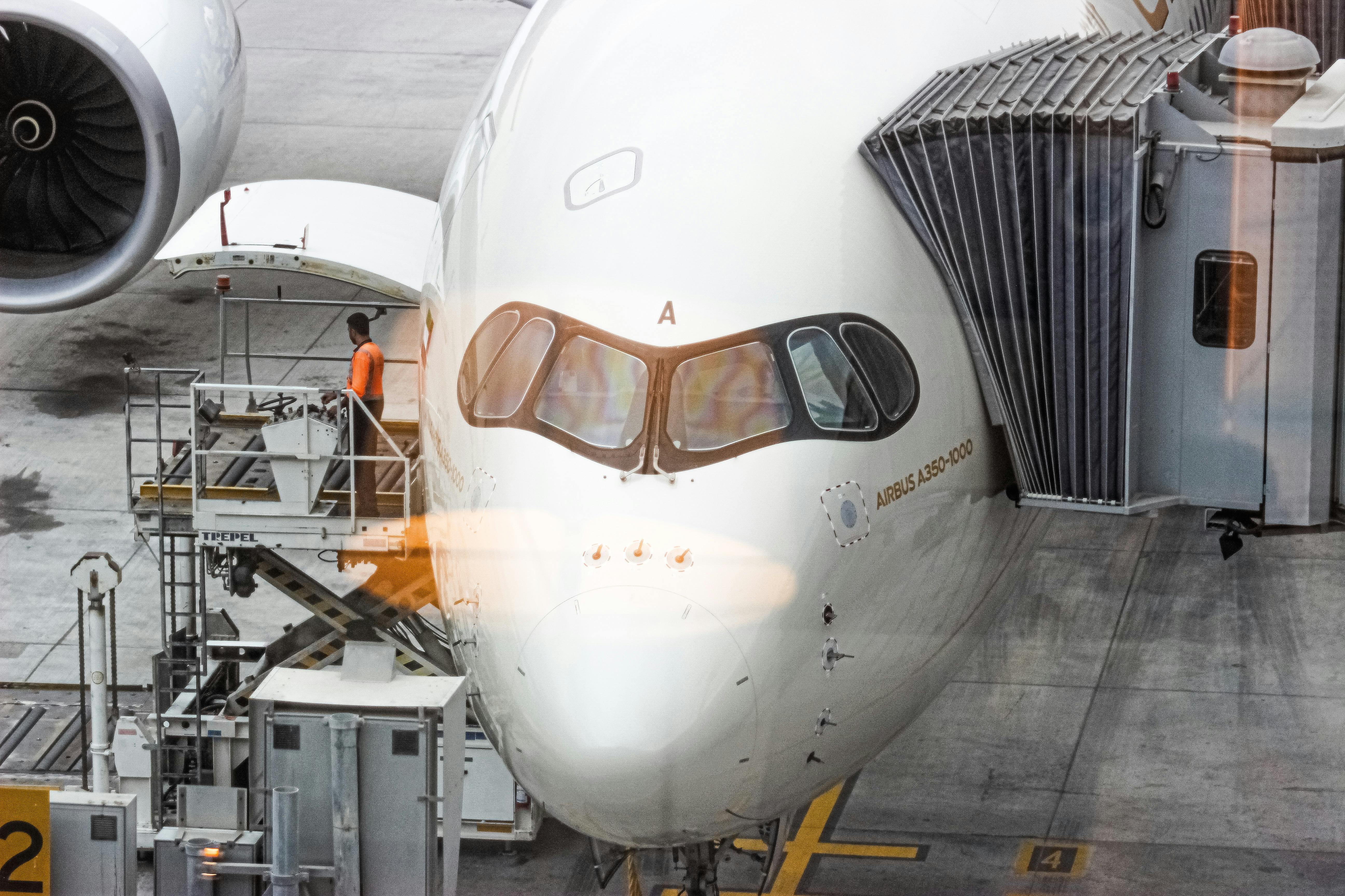 Airbus A350-1000 Parked at Airport Gate · Free Stock Photo