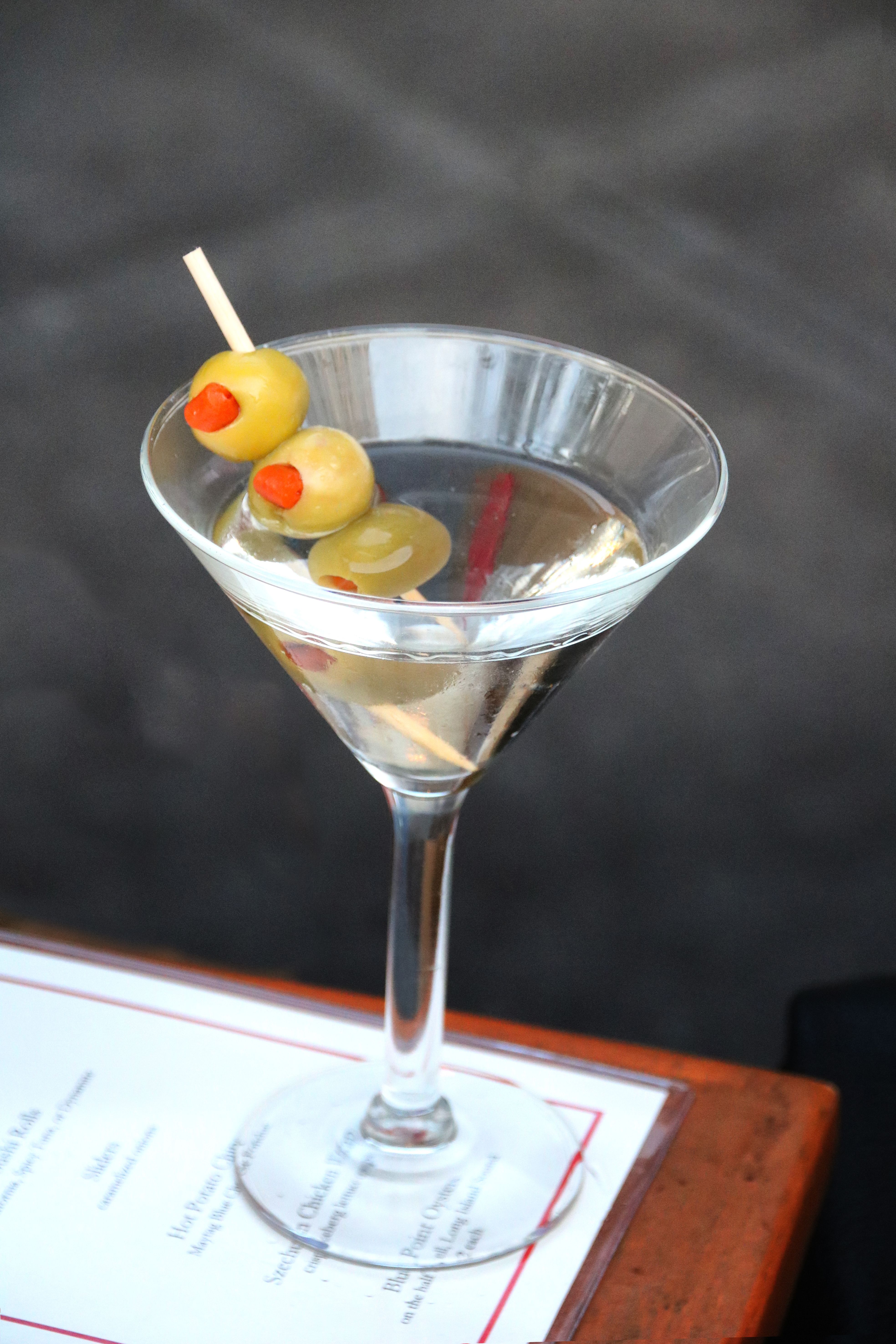 Elegant Martini with Green Olives on Glass Table · Free Stock Photo