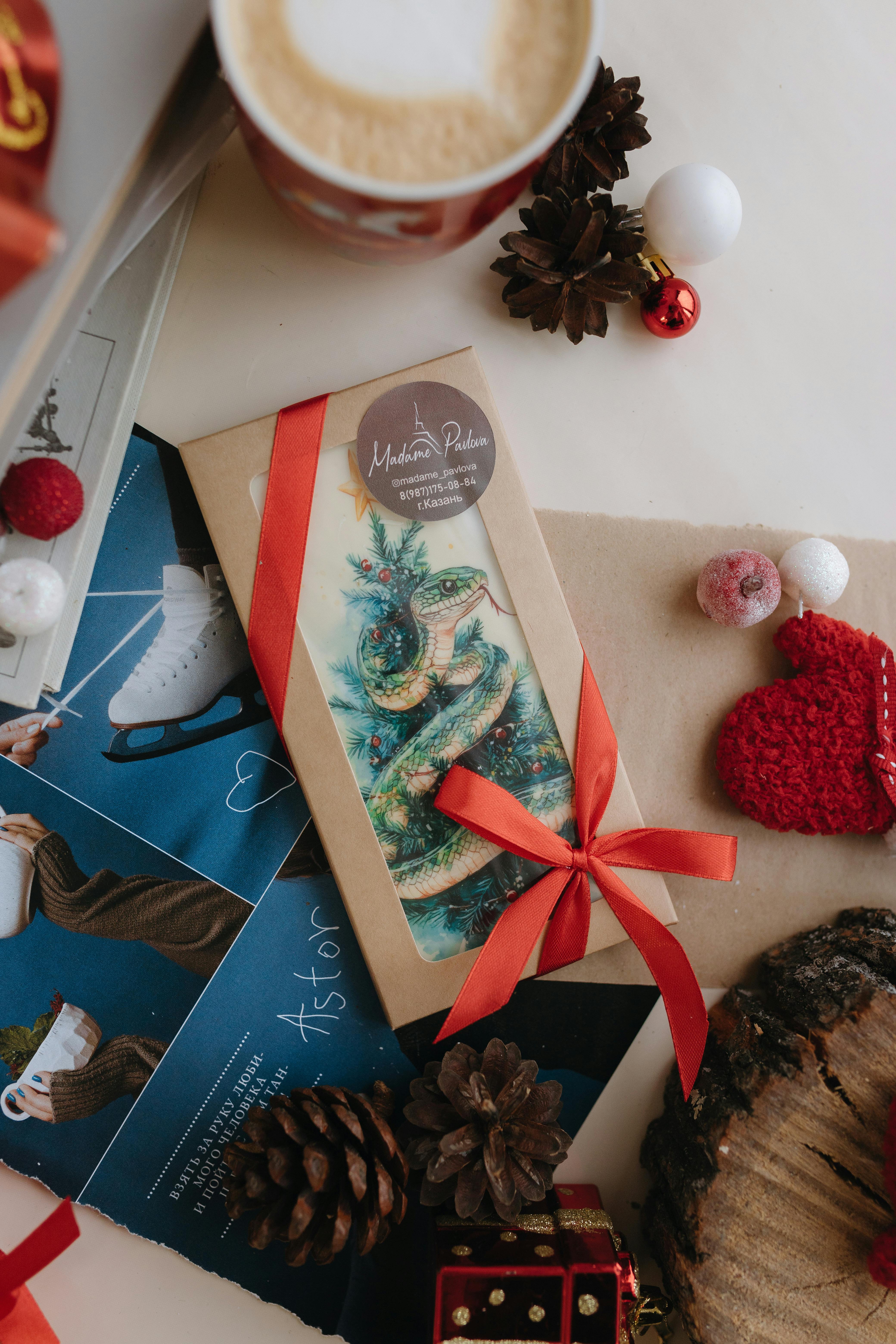 Festive Holiday Flat Lay with Gift and Decorations · Free Stock Photo
