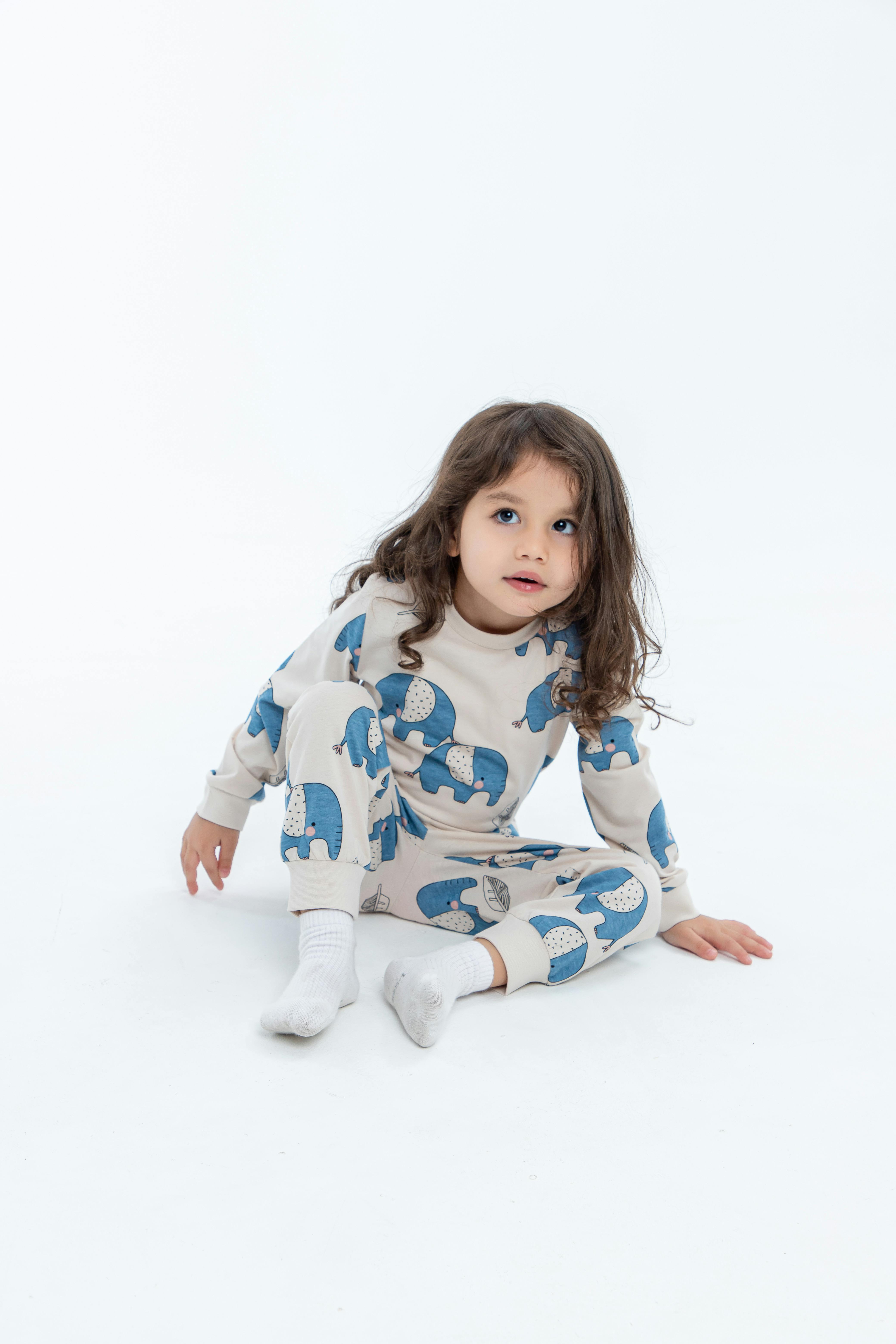 Adorable Child in Elephant Print Pajamas · Free Stock Photo