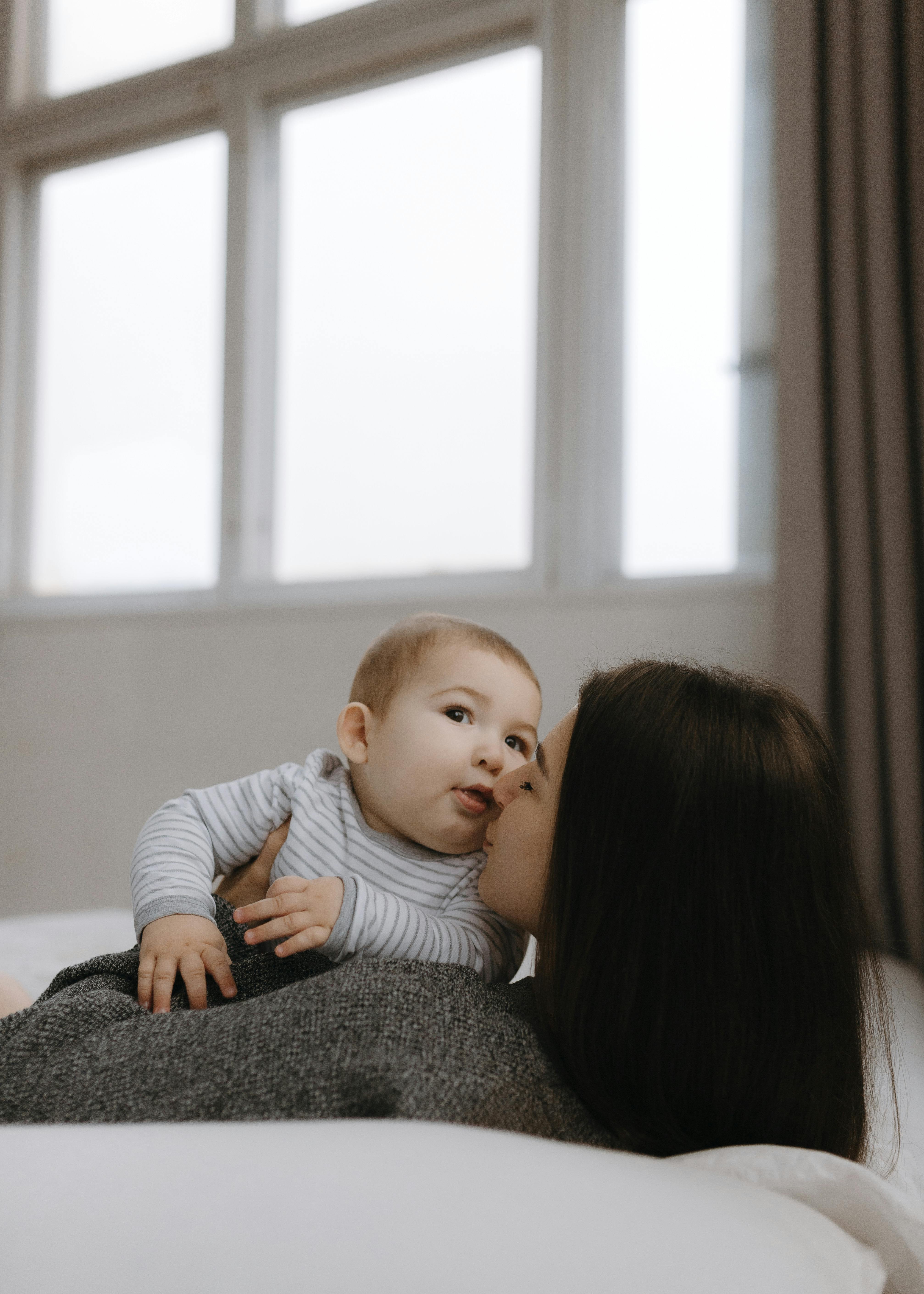 Tender Mother and Baby Moment Indoors · Free Stock Photo