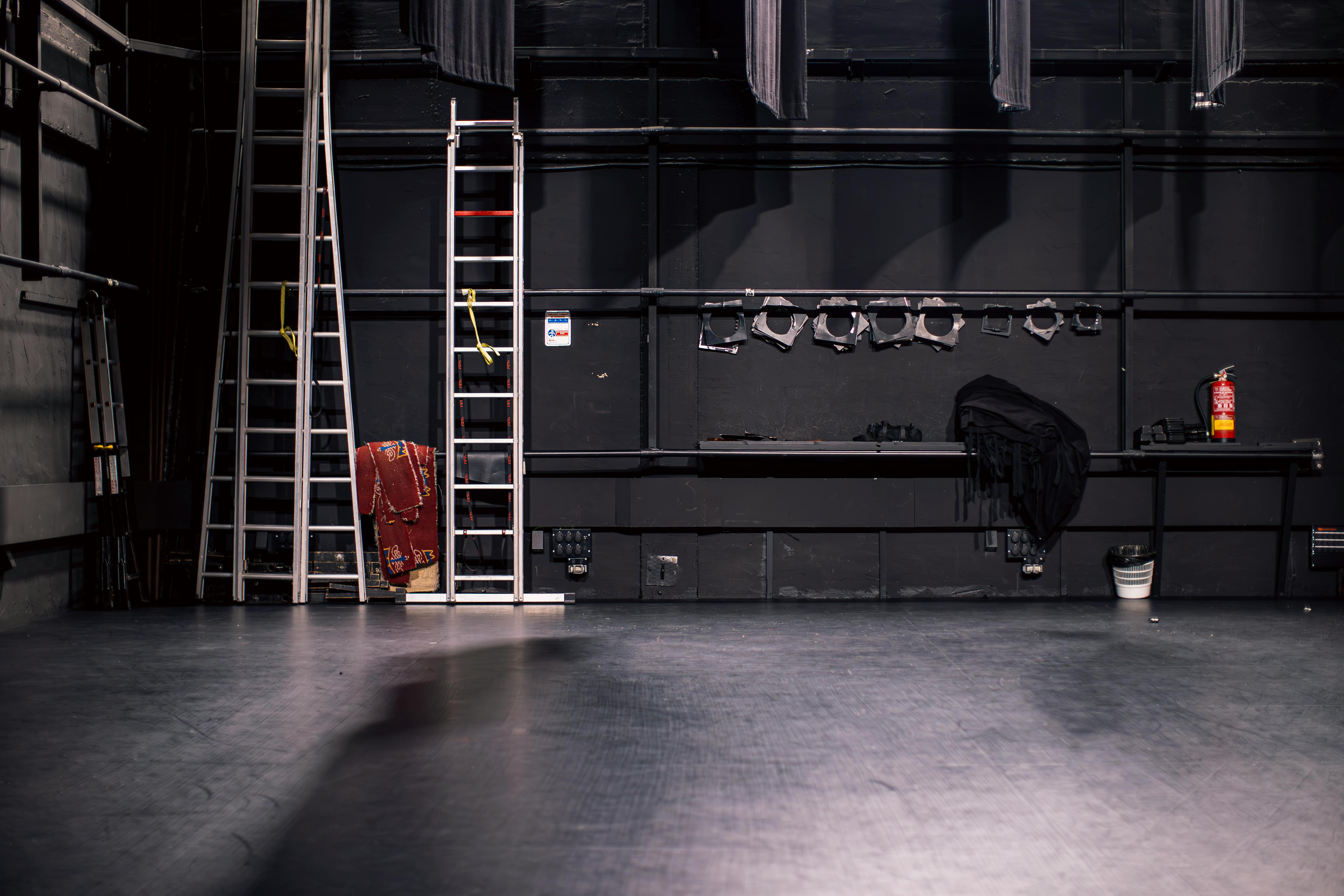 Empty Theater Stage with Ladders and Equipment · Free Stock Photo