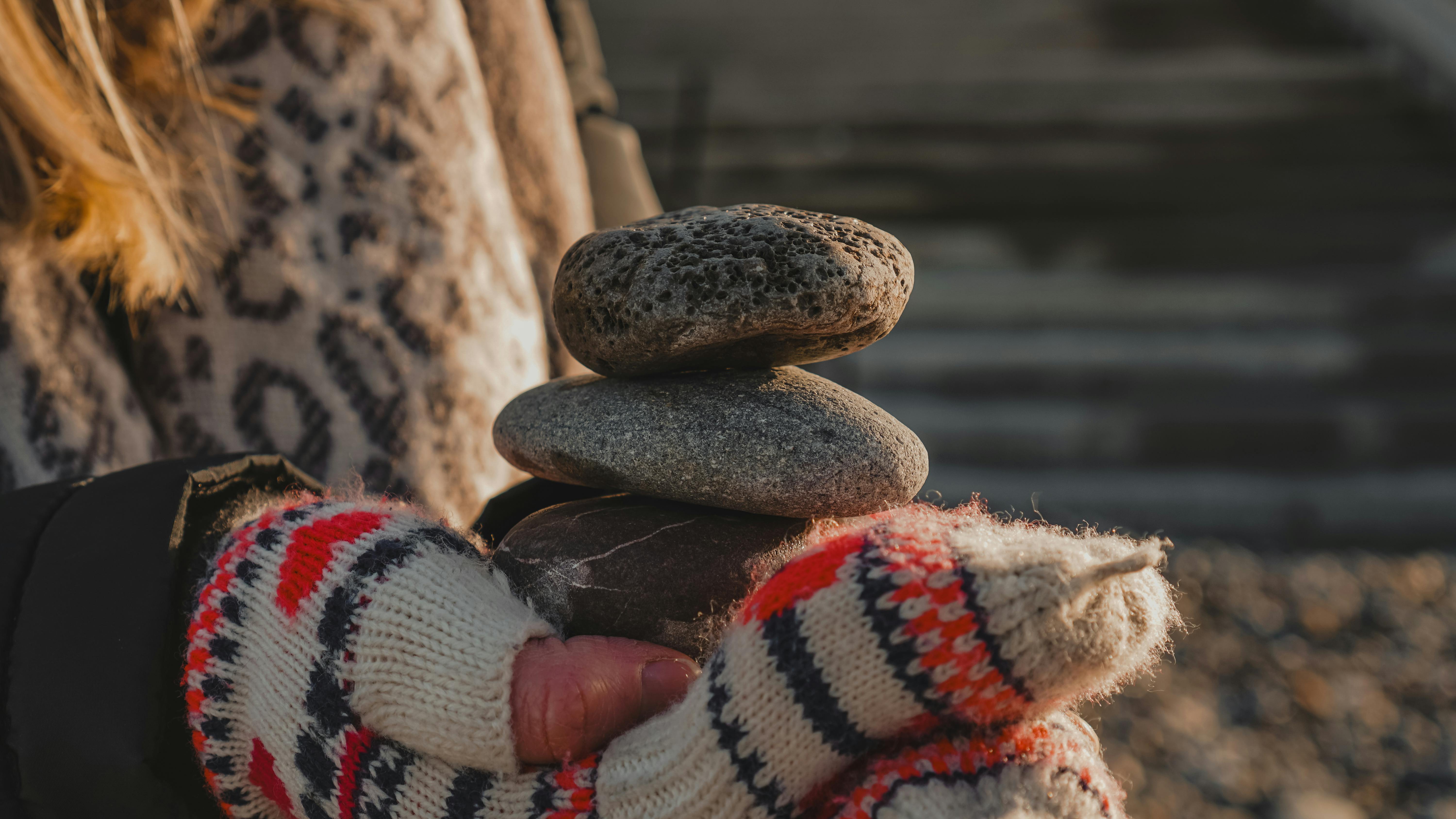 Cozy Winter Scene with Stacked Pebbles · Free Stock Photo