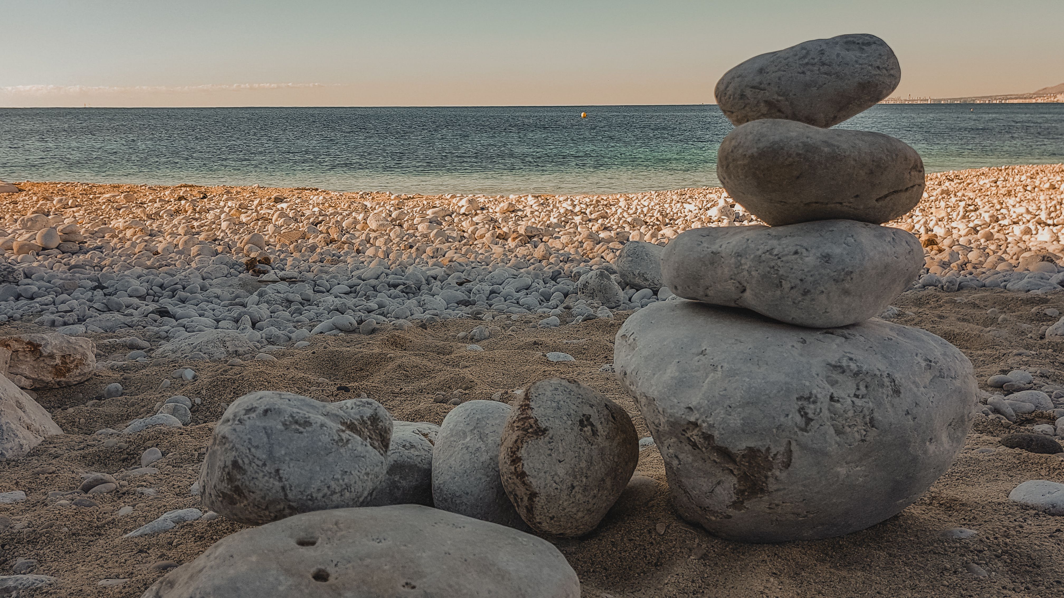 Tranquil Stack of Stones by the Seaside · Free Stock Photo