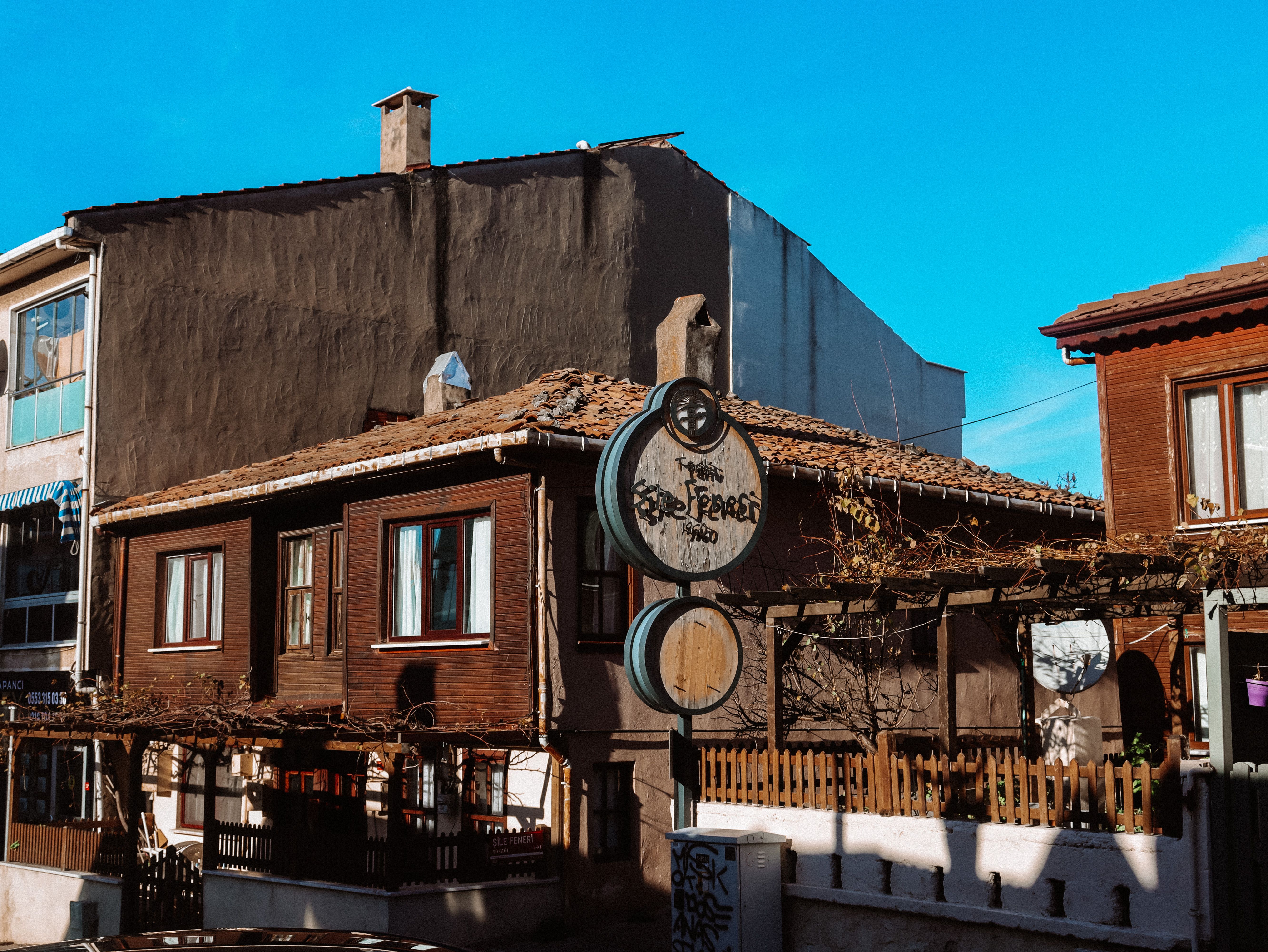 Charming Traditional Wooden House in Urban Setting · Free Stock Photo