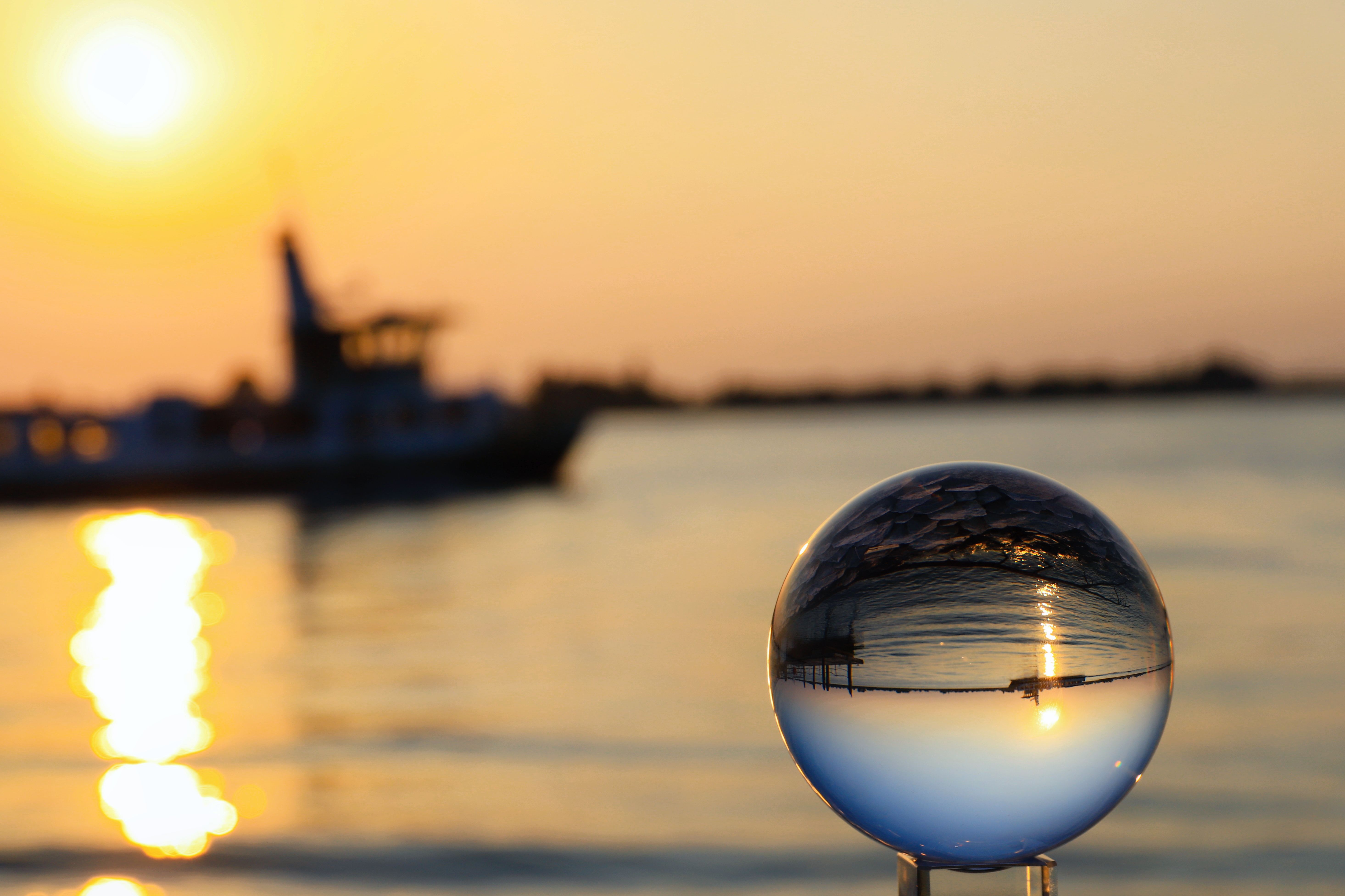 Reflective Glass Ball at Sunset on Italian Lake · Free Stock Photo