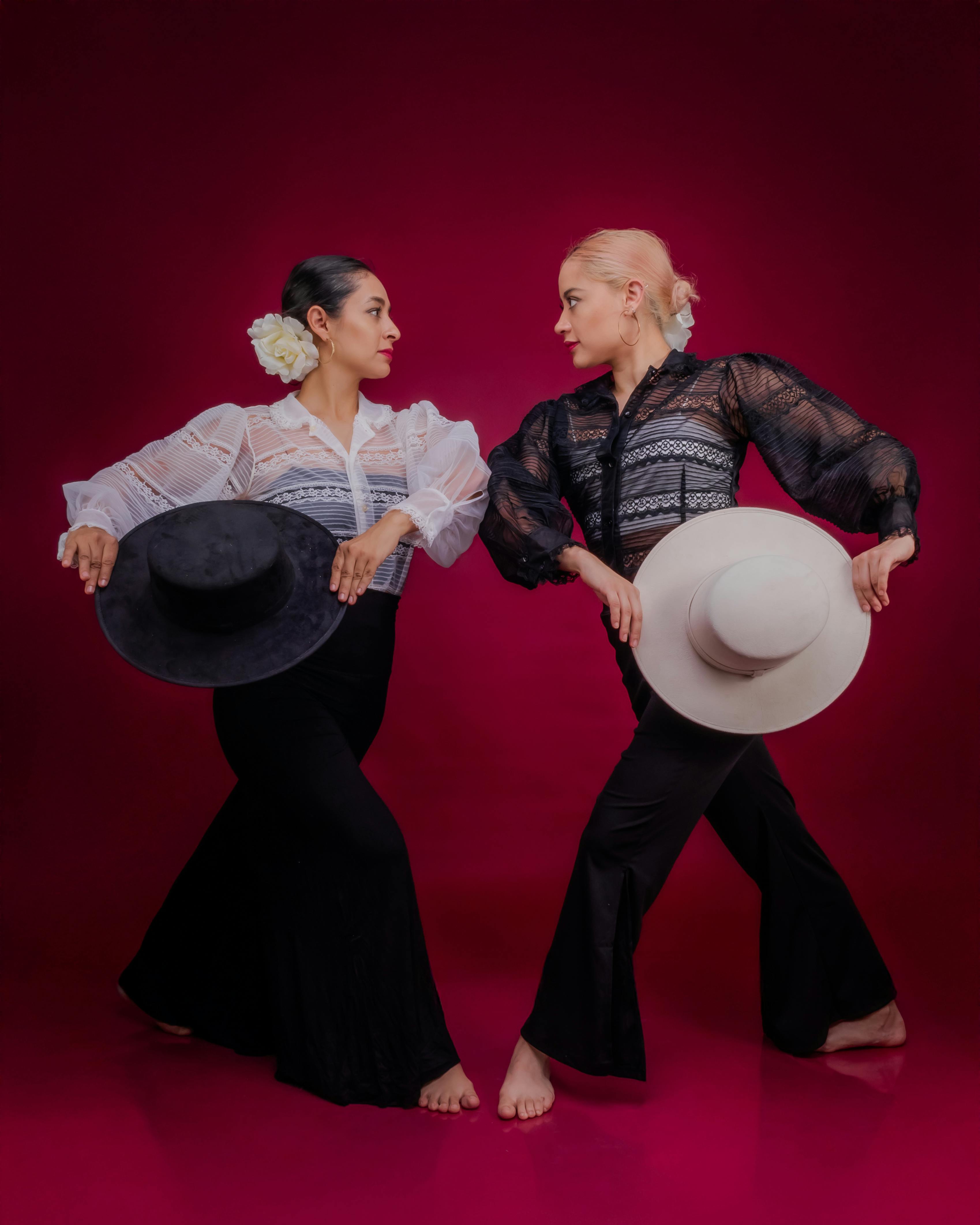 Dynamic Female Dancer in Red Dress Captured Mid-Motion · Free Stock Photo