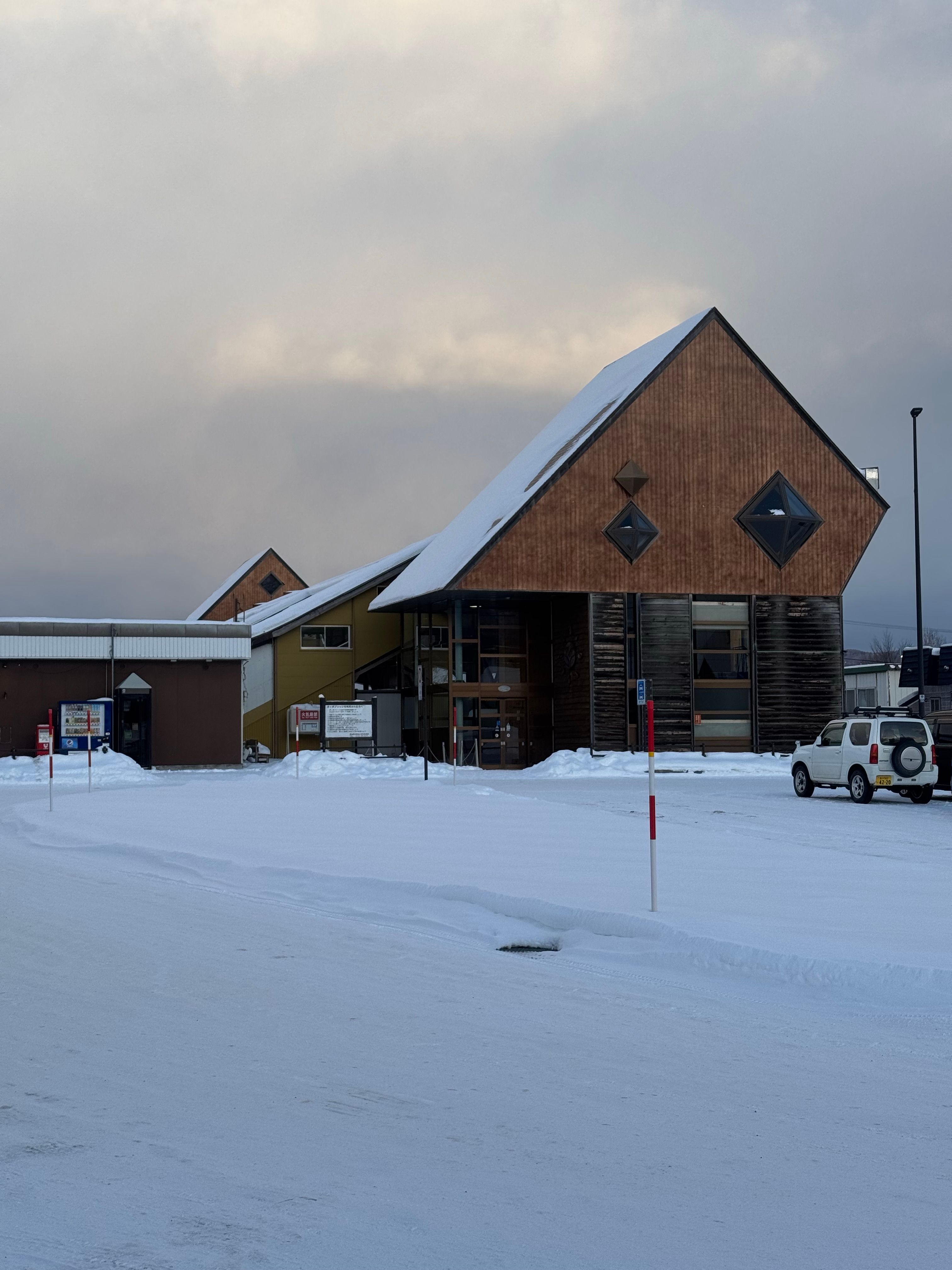 Modern Wooden Building in Snowy Winter Landscape · Free Stock Photo