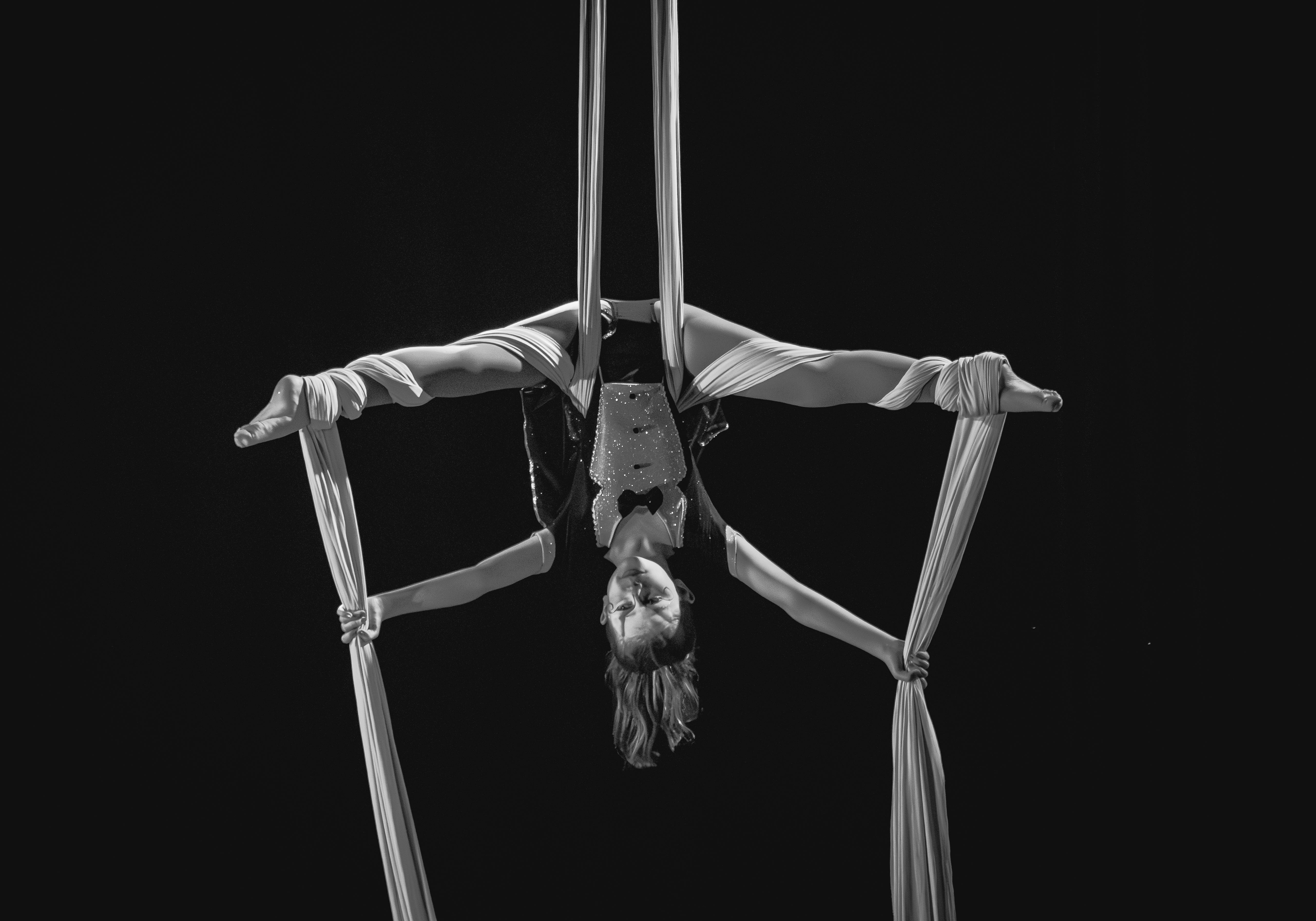 Graceful Aerial Silk Performance in Black and White · Free Stock Photo
