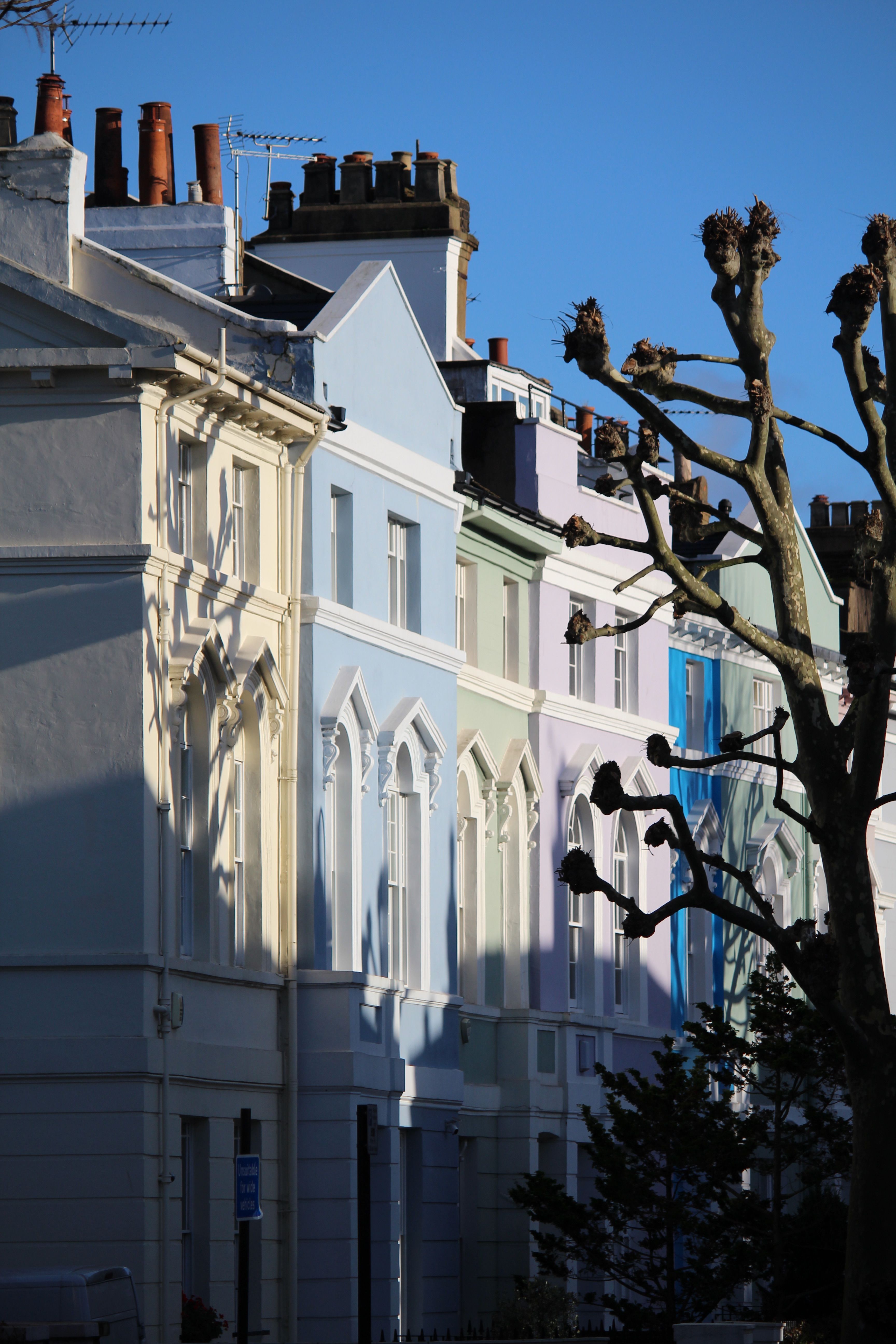 Colorful Victorian Houses in Sunlit Street · Free Stock Photo