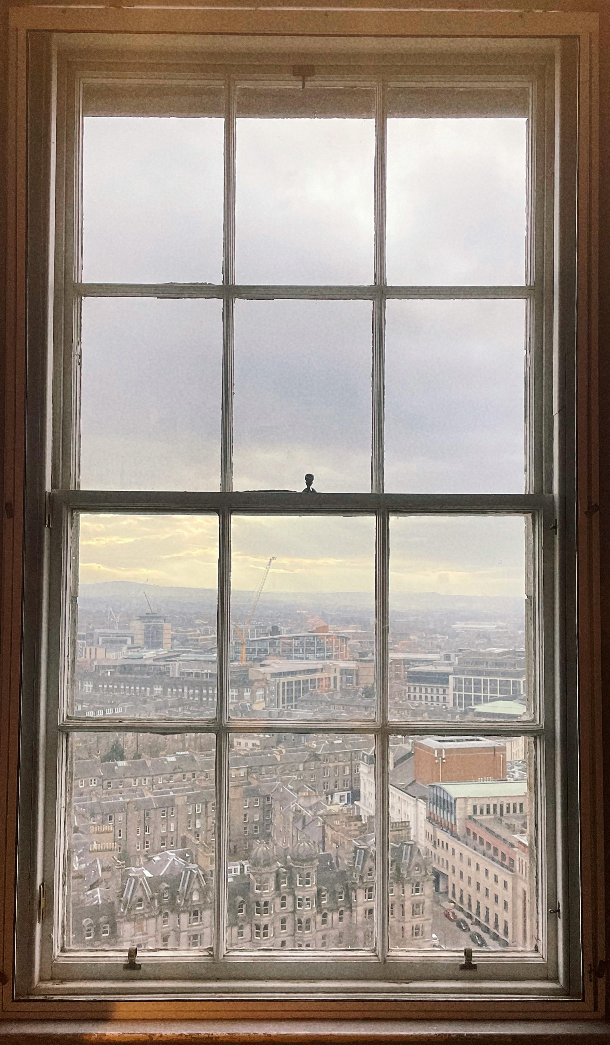 Cityscape View Through Vintage Window · Free Stock Photo