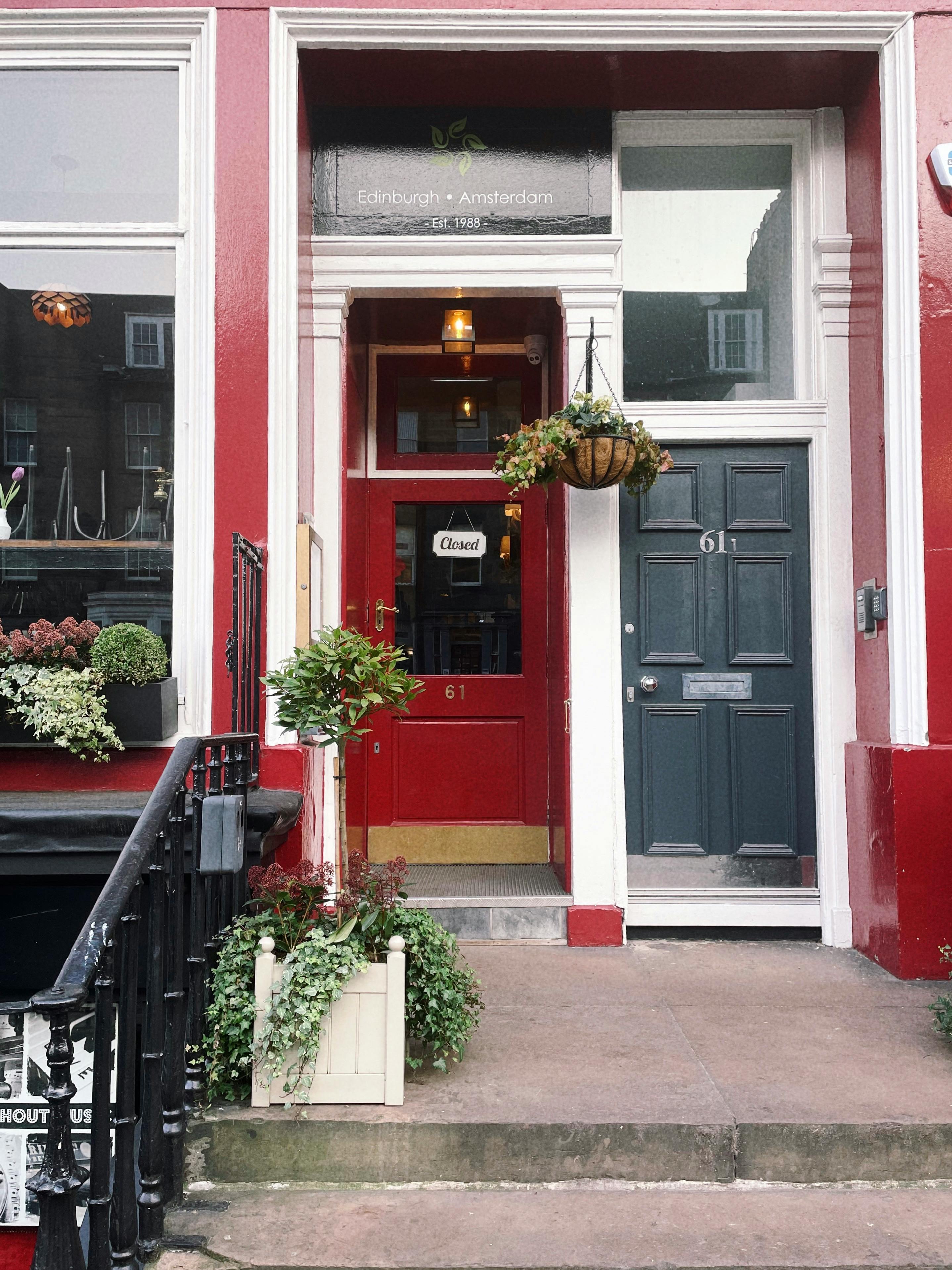 Charming Red Door in Amsterdam Street Scene · Free Stock Photo