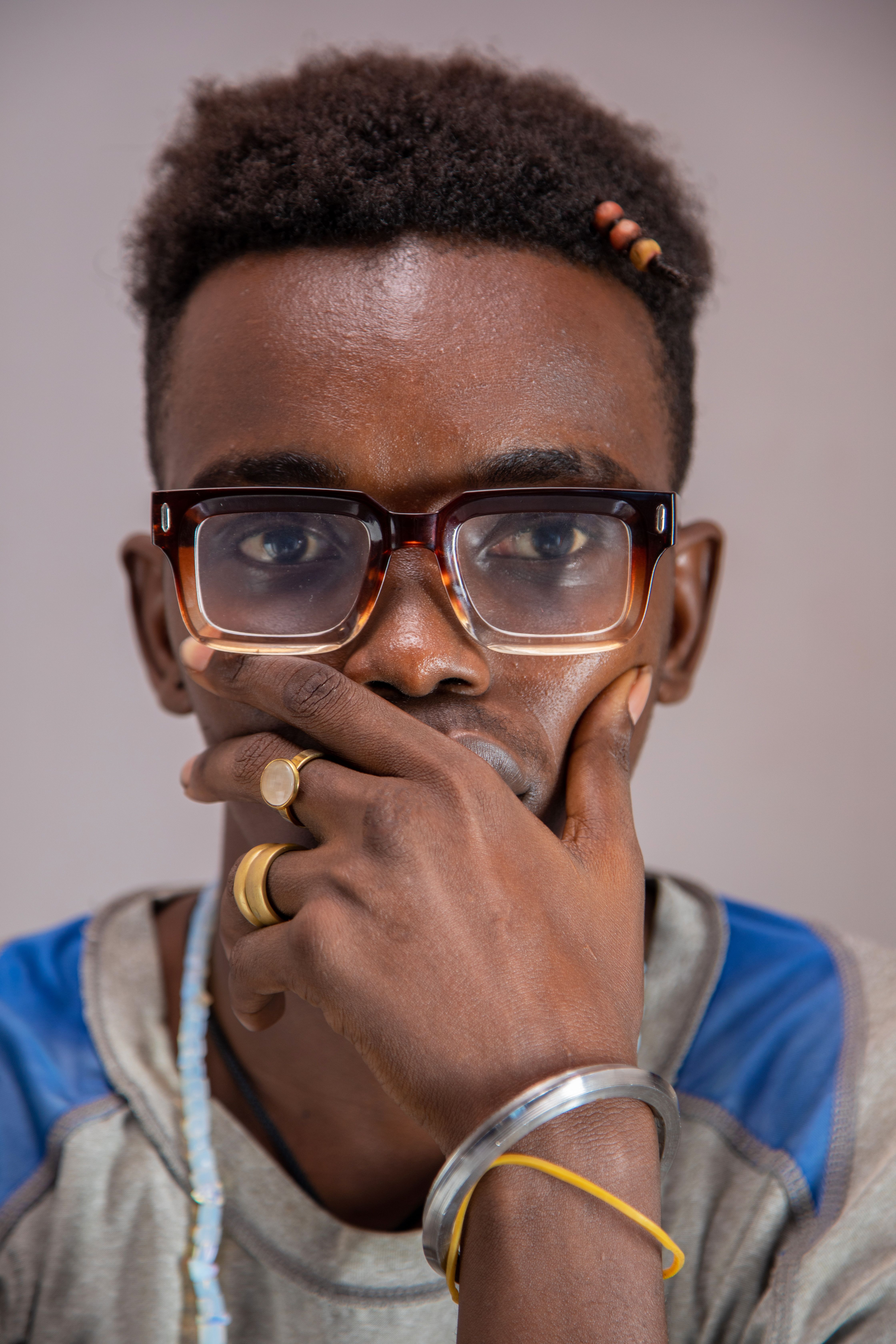 Stylish Young Man in Sunglasses Against Red · Free Stock Photo