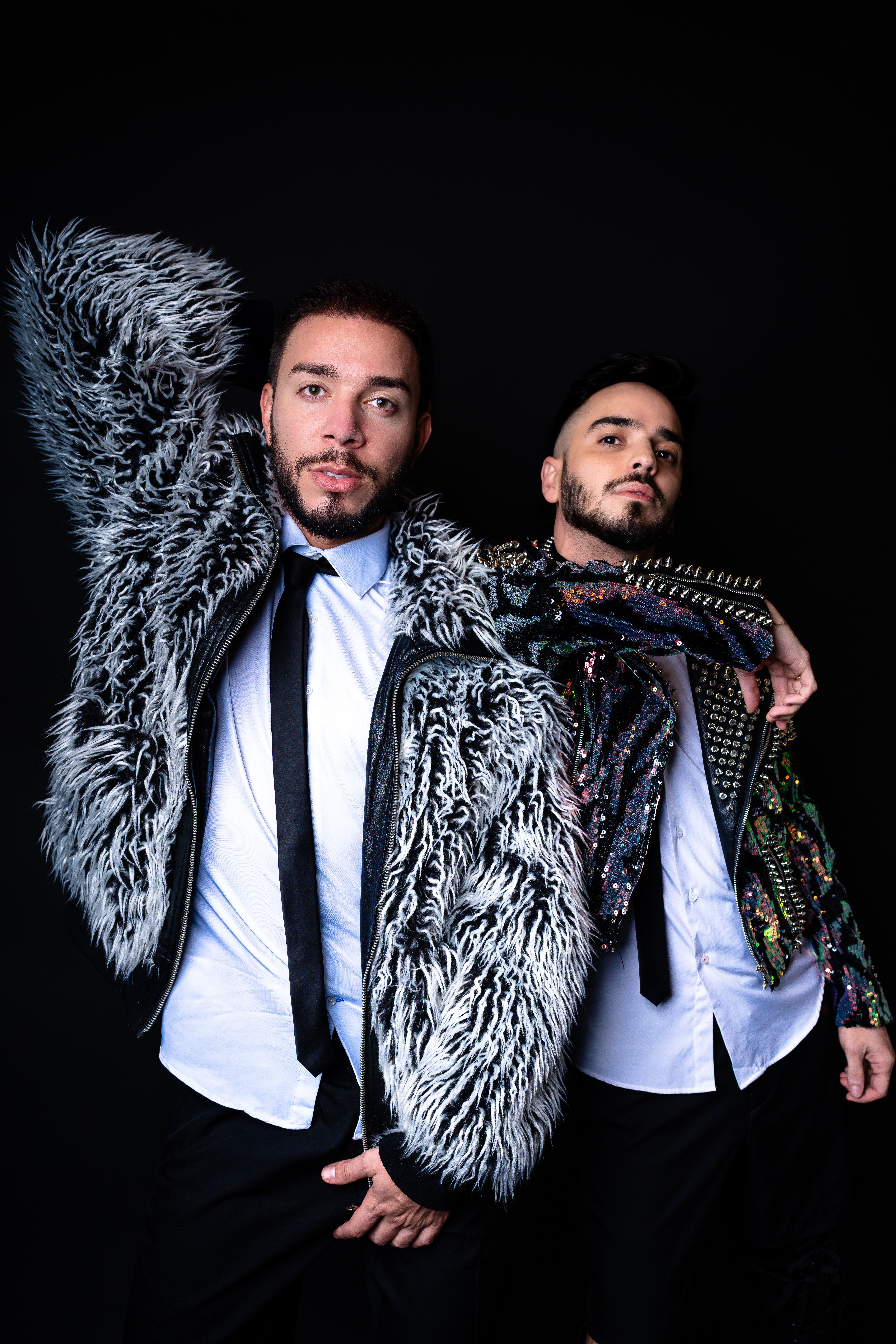 Stylish Portrait of Two Men in Unique Fur Coats · Free Stock Photo