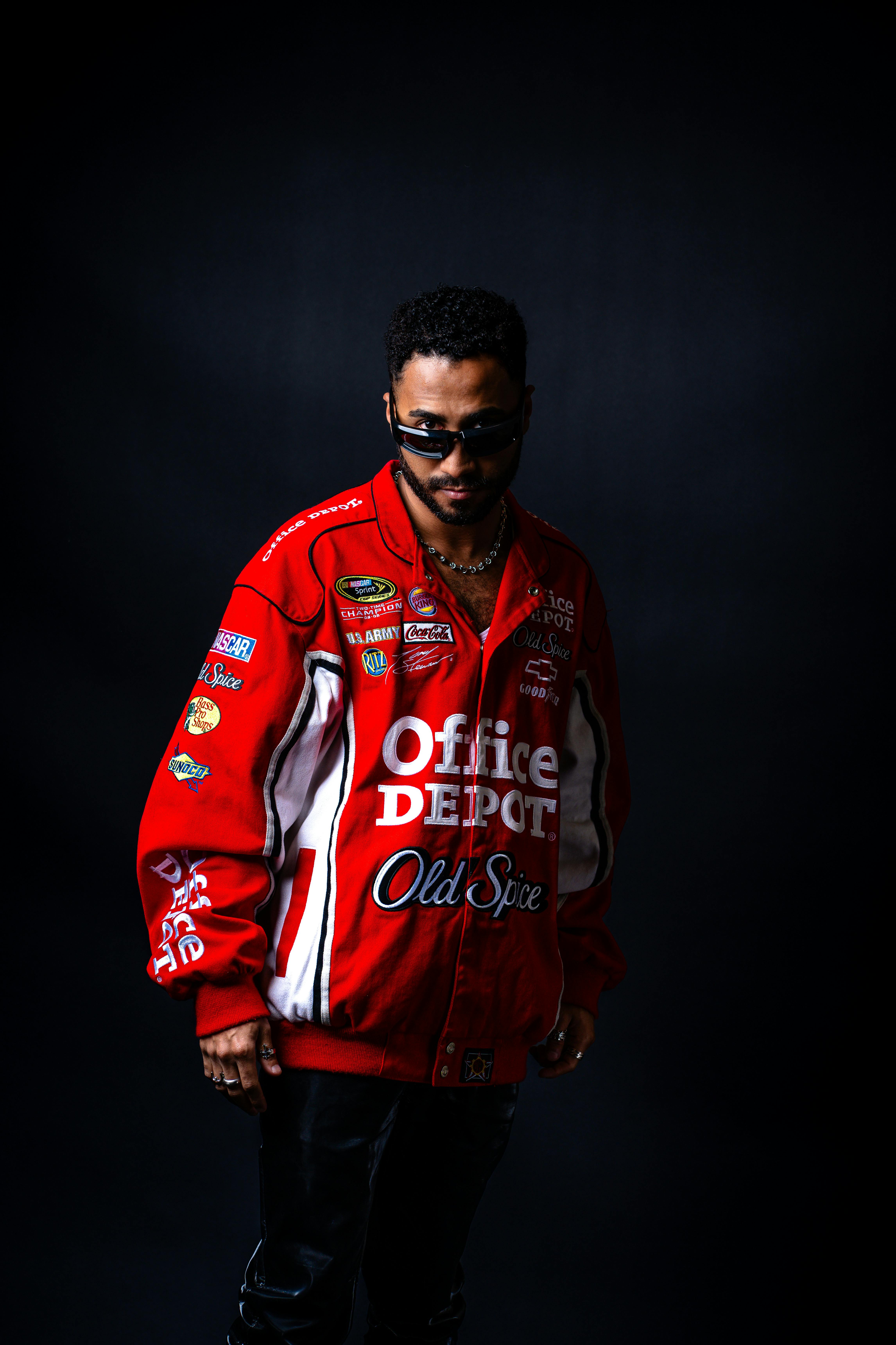 Stylish Man in Racing Jacket with Sunglasses · Free Stock Photo