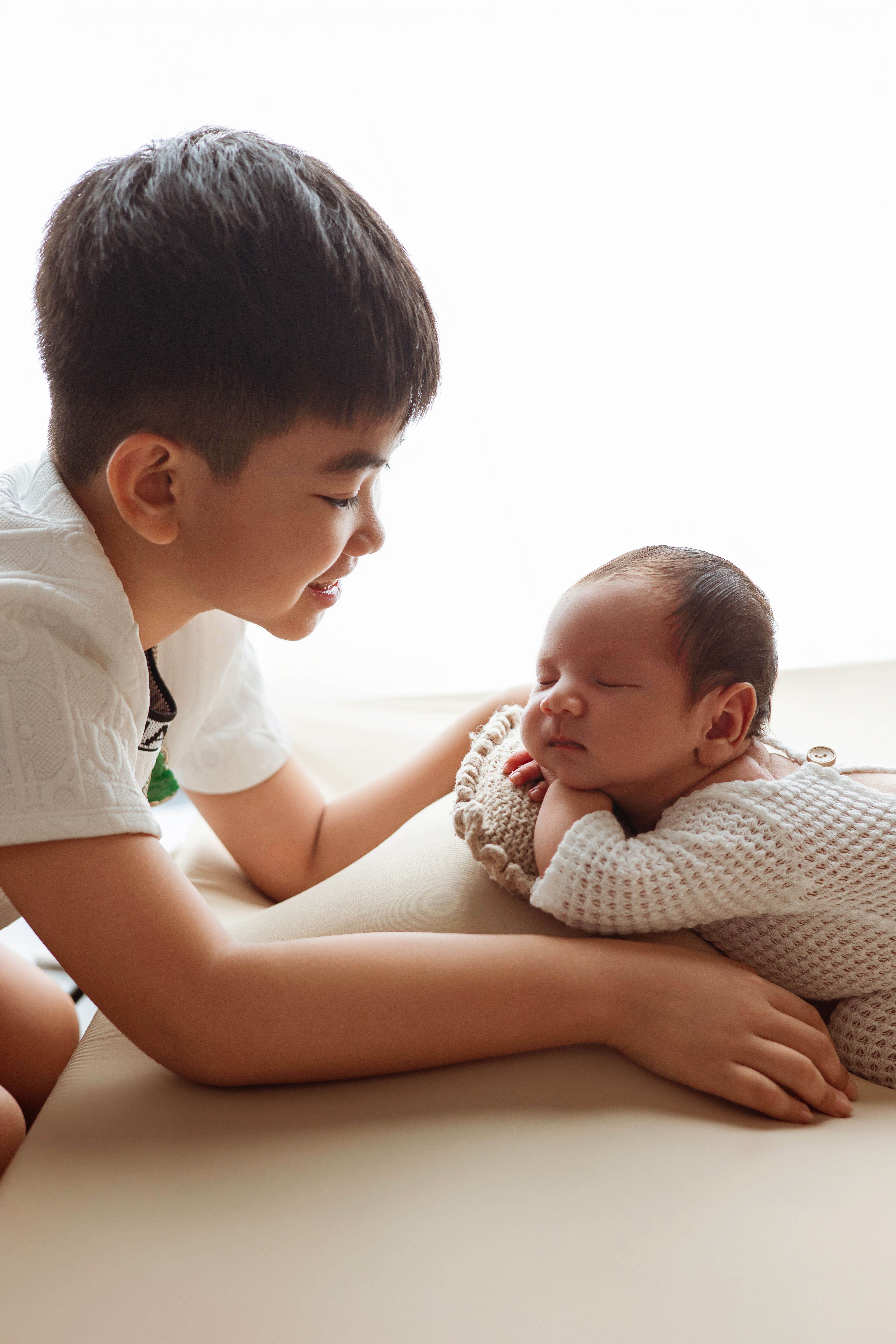 Tender Moment Between Brothers in Natural Light · Free Stock Photo