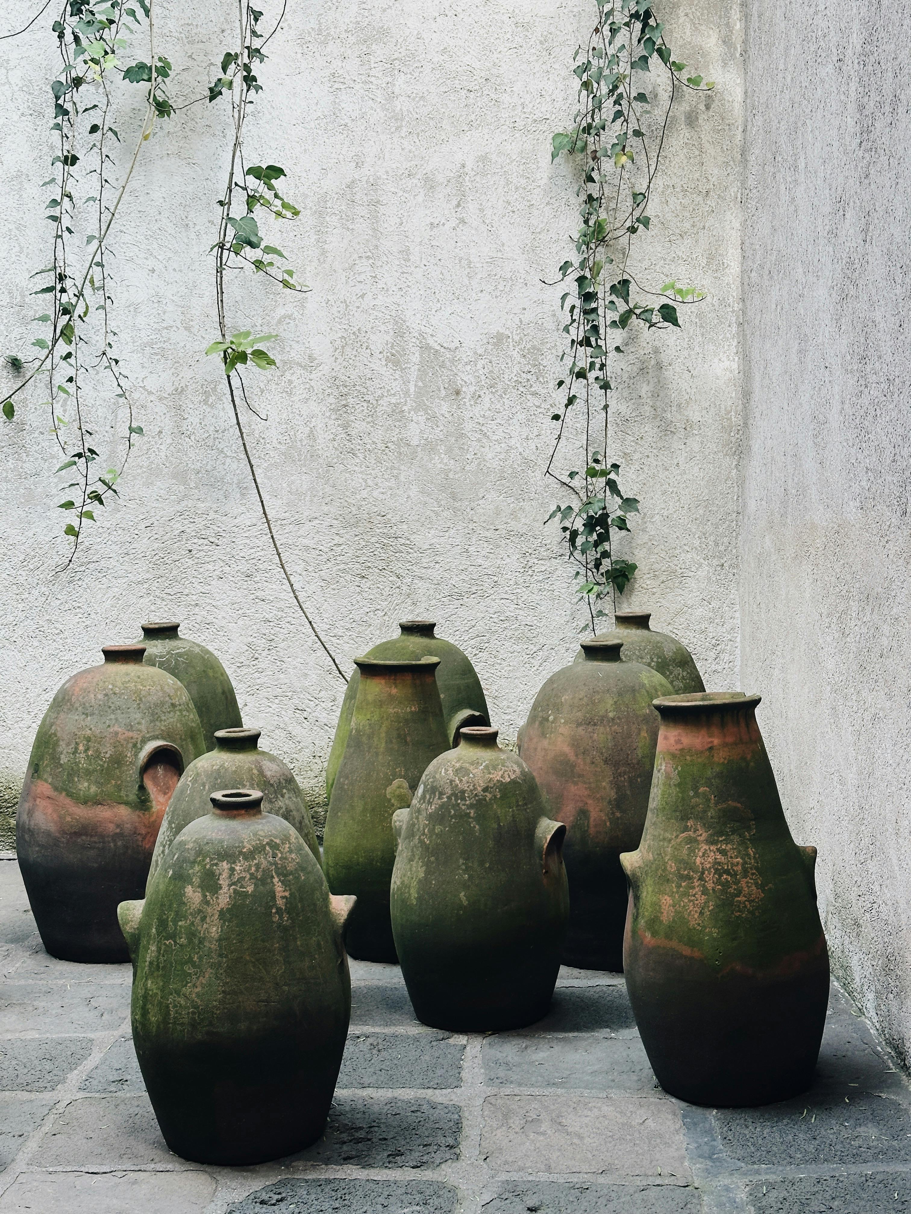 Rustic Clay Pots in Mexican Courtyard · Free Stock Photo