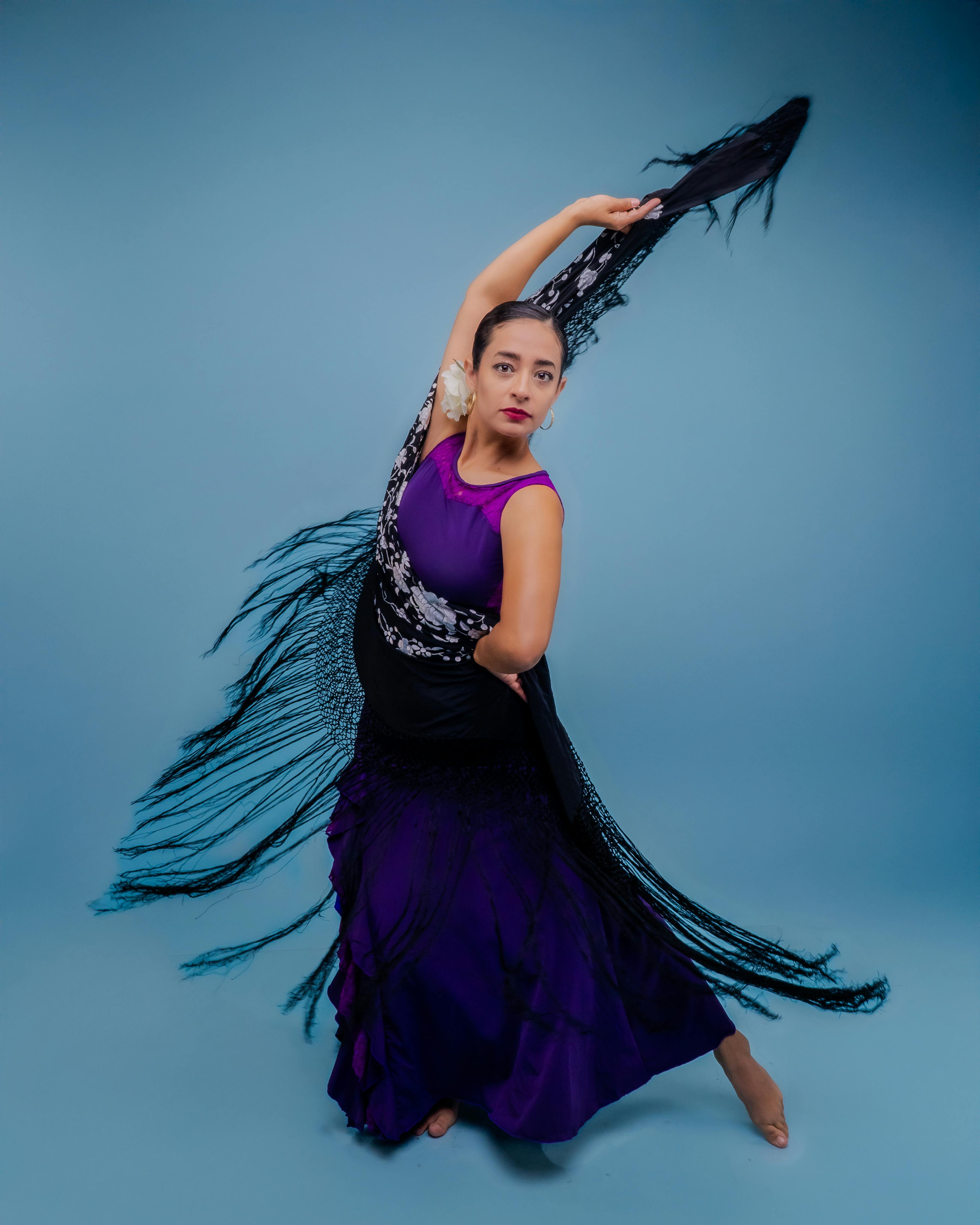 Dynamic Female Dancer in Red Dress Captured Mid-Motion · Free Stock Photo