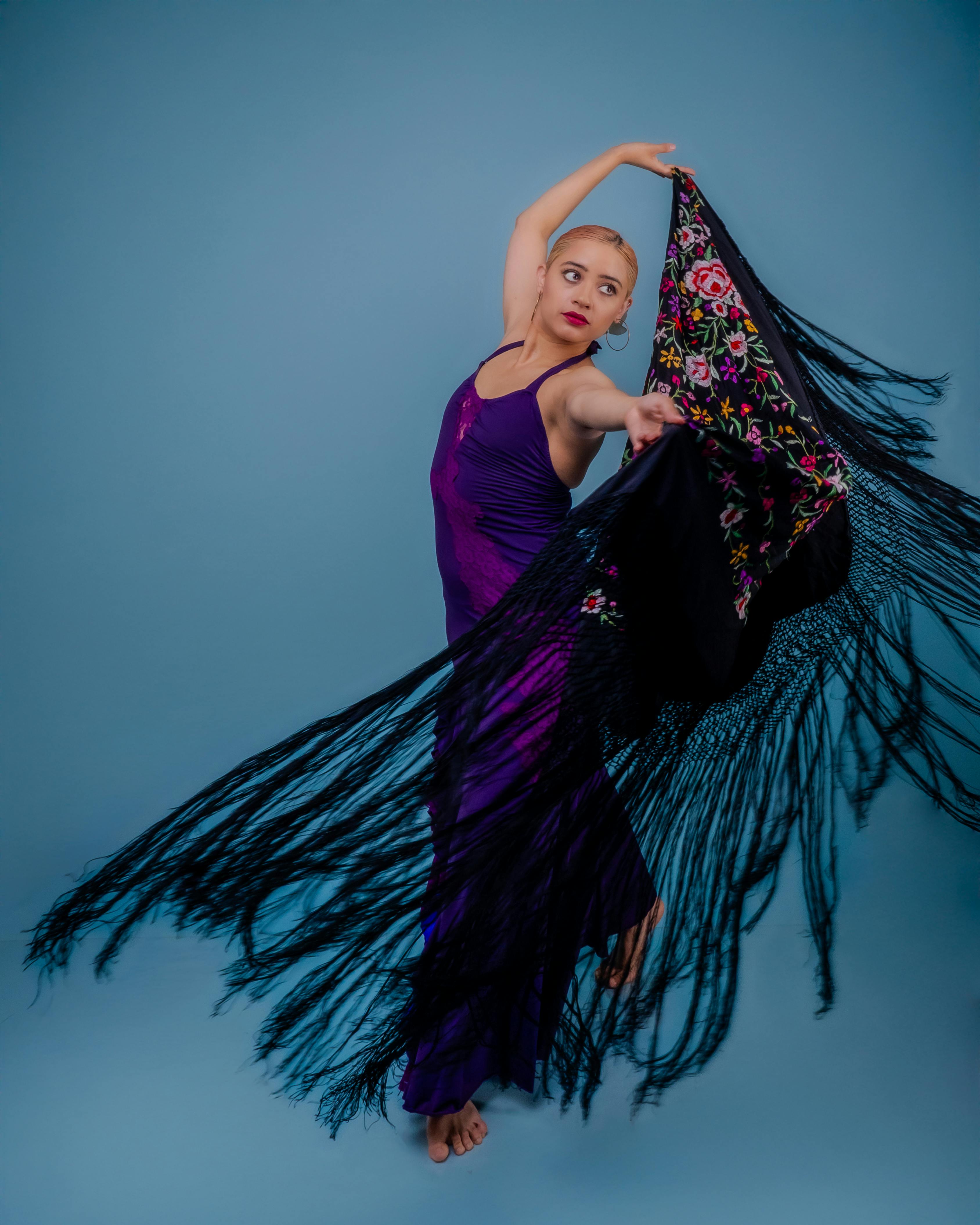 Dynamic Female Dancer in Red Dress Captured Mid-Motion · Free Stock Photo