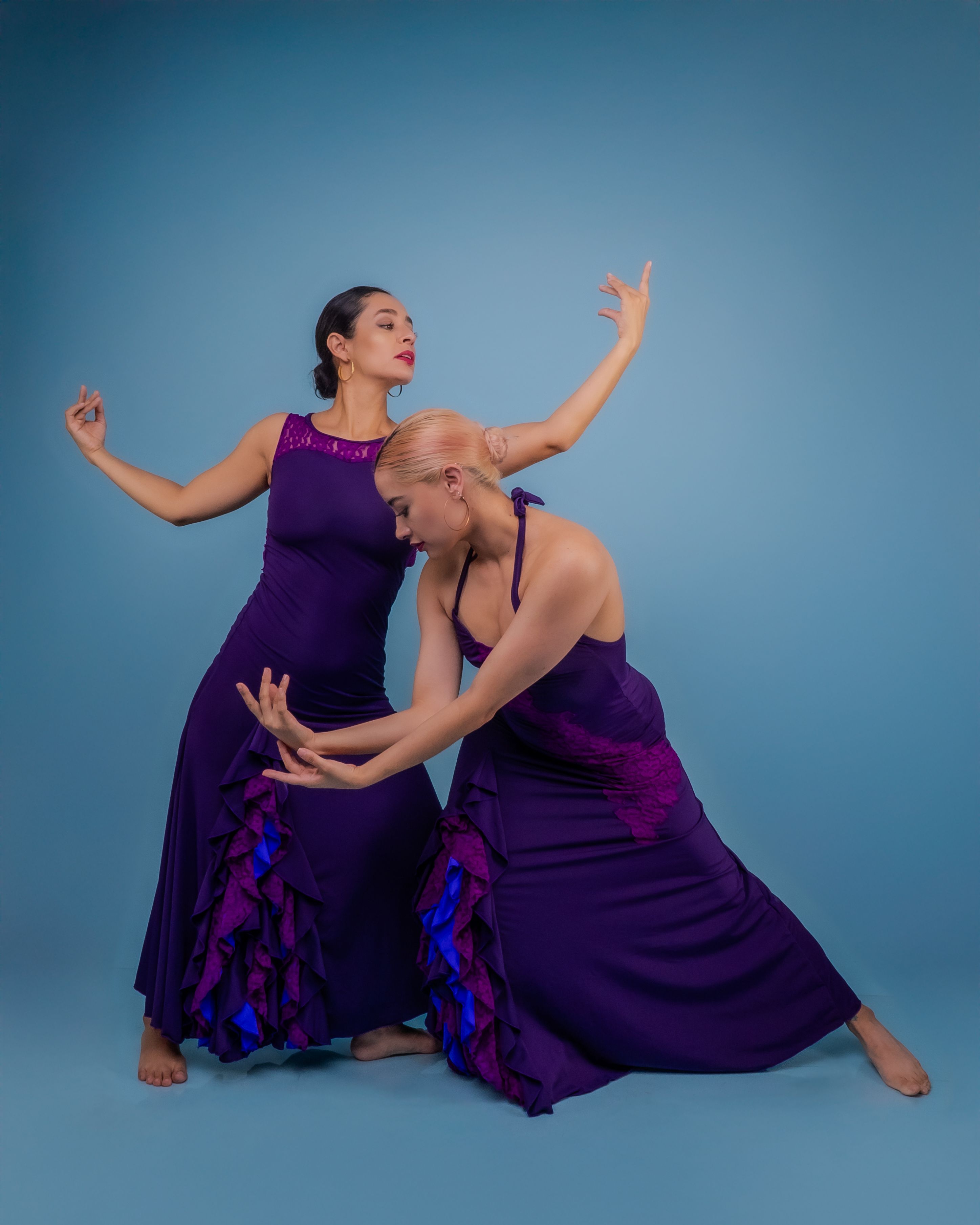 Dynamic Dance Duo in Vibrant Purple Attire · Free Stock Photo