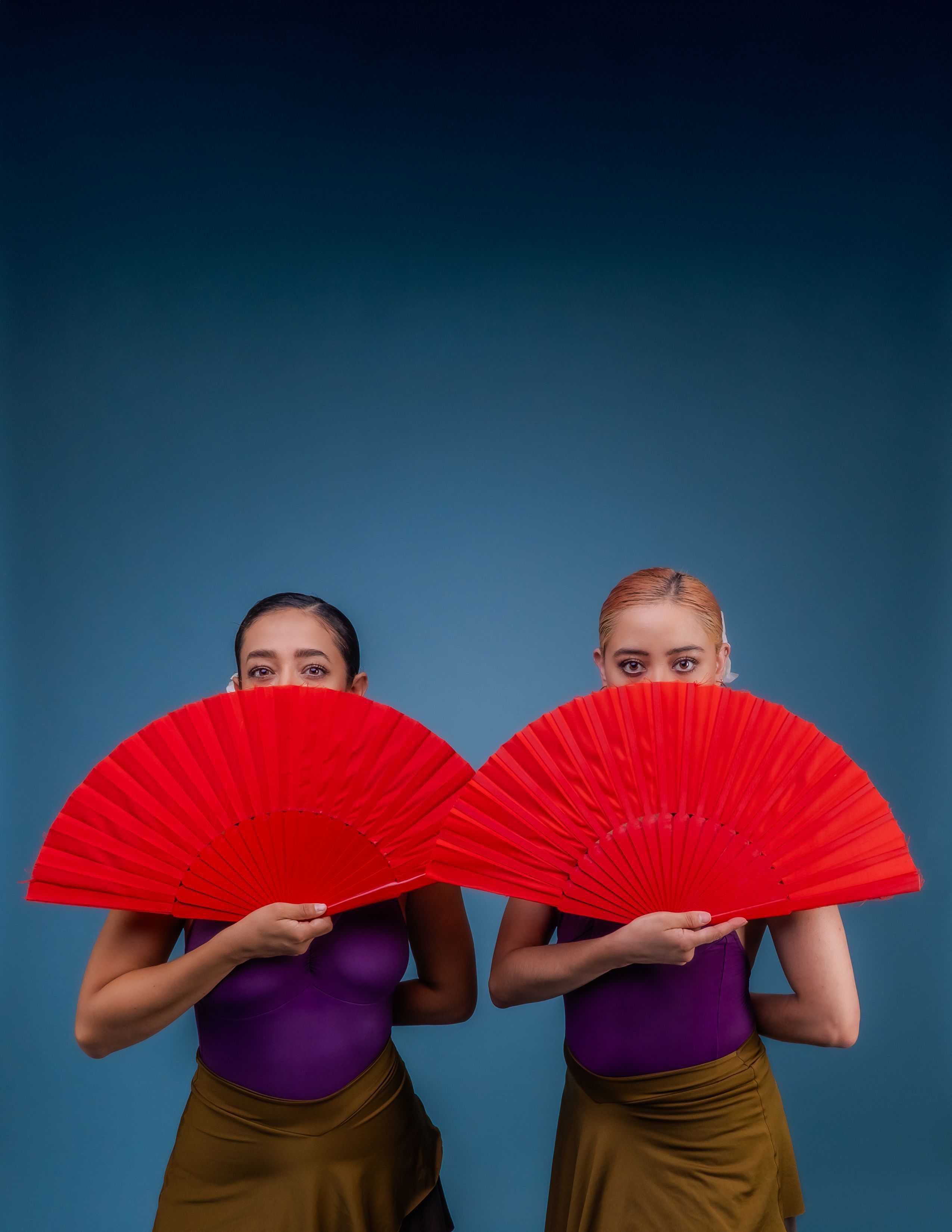 Colorful Dance Expression with Red Fans · Free Stock Photo