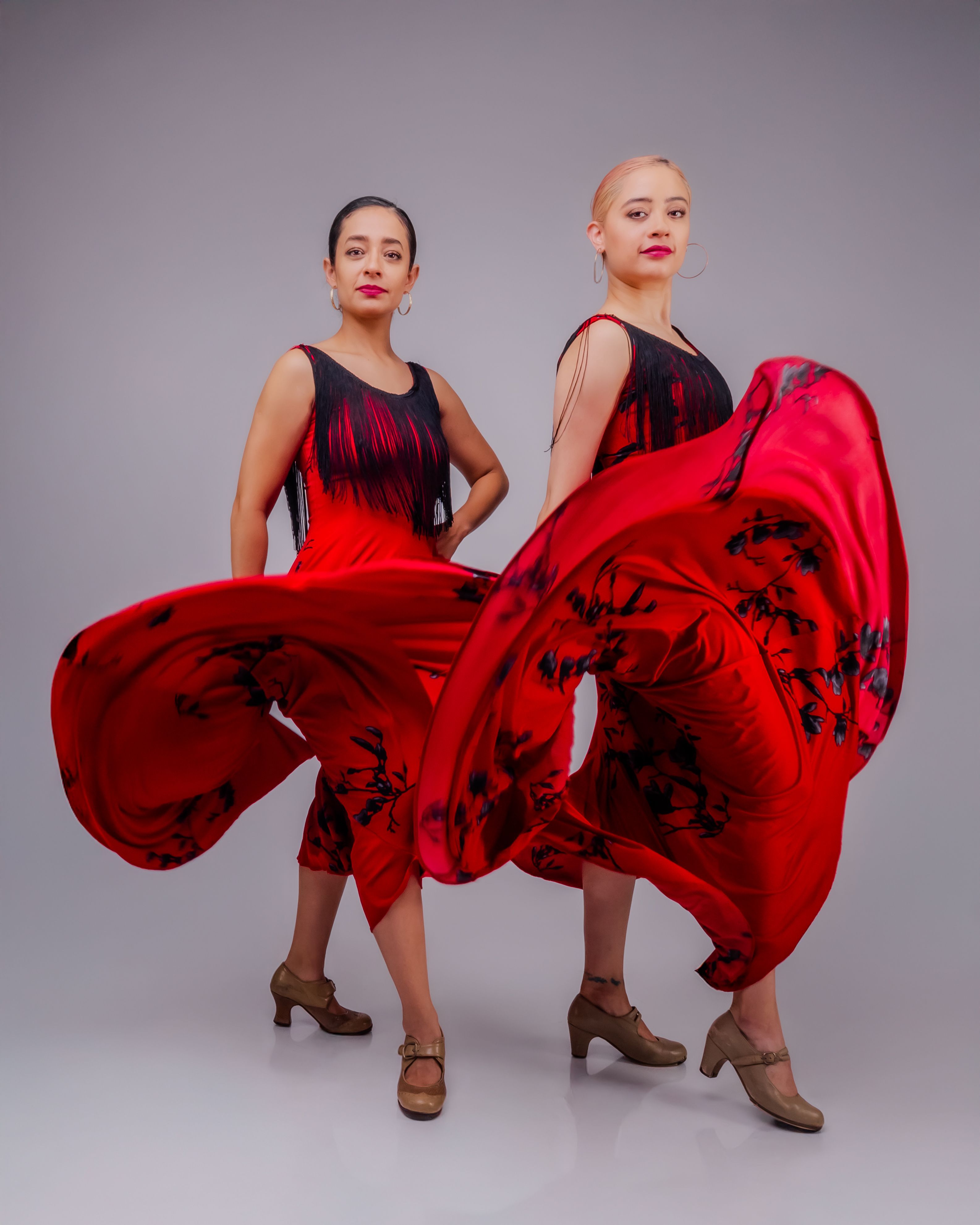Elegant Flamenco Dancers in Vibrant Red Attire · Free Stock Photo