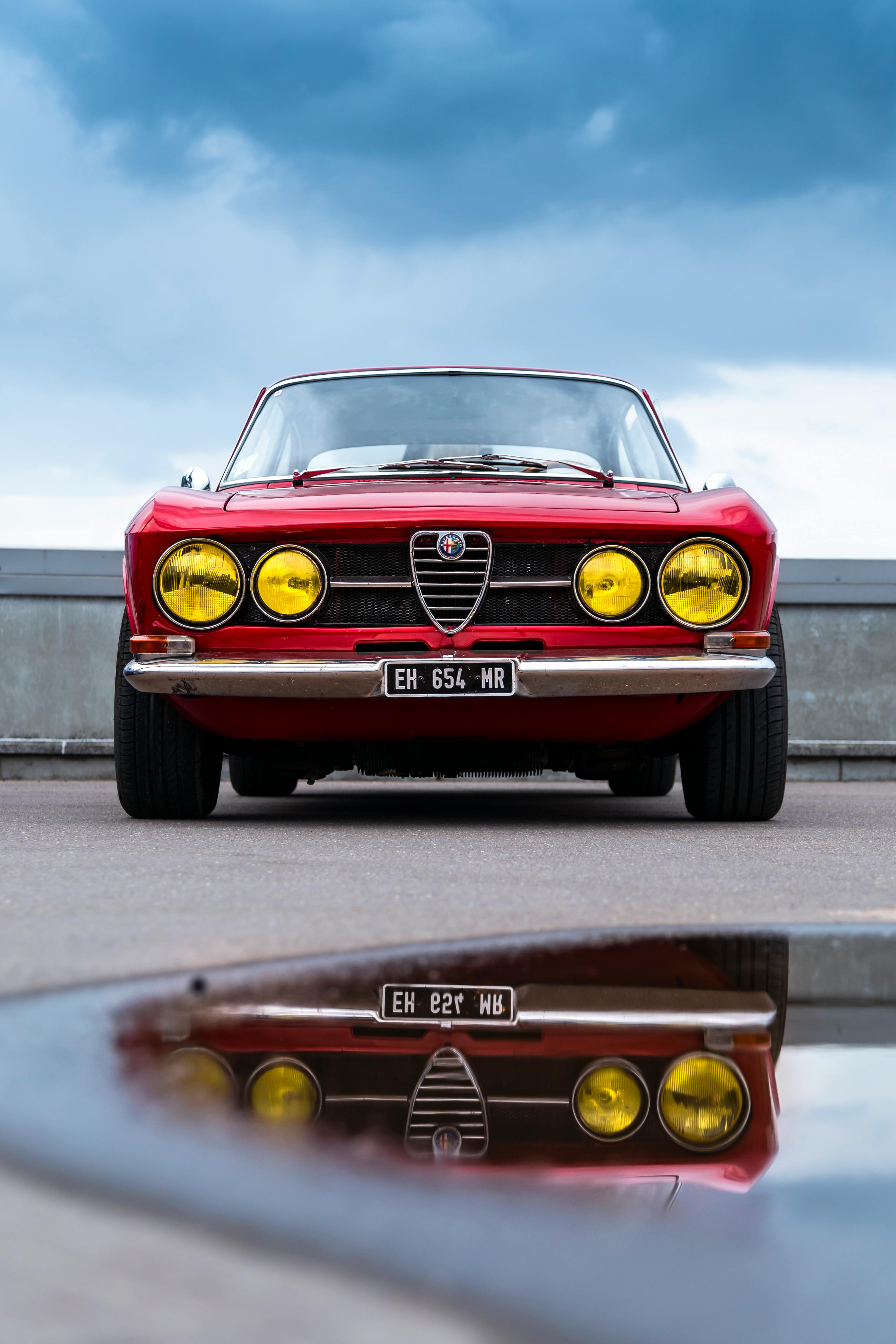 Vintage Alfa Romeo on a Cloudy Day · Free Stock Photo
