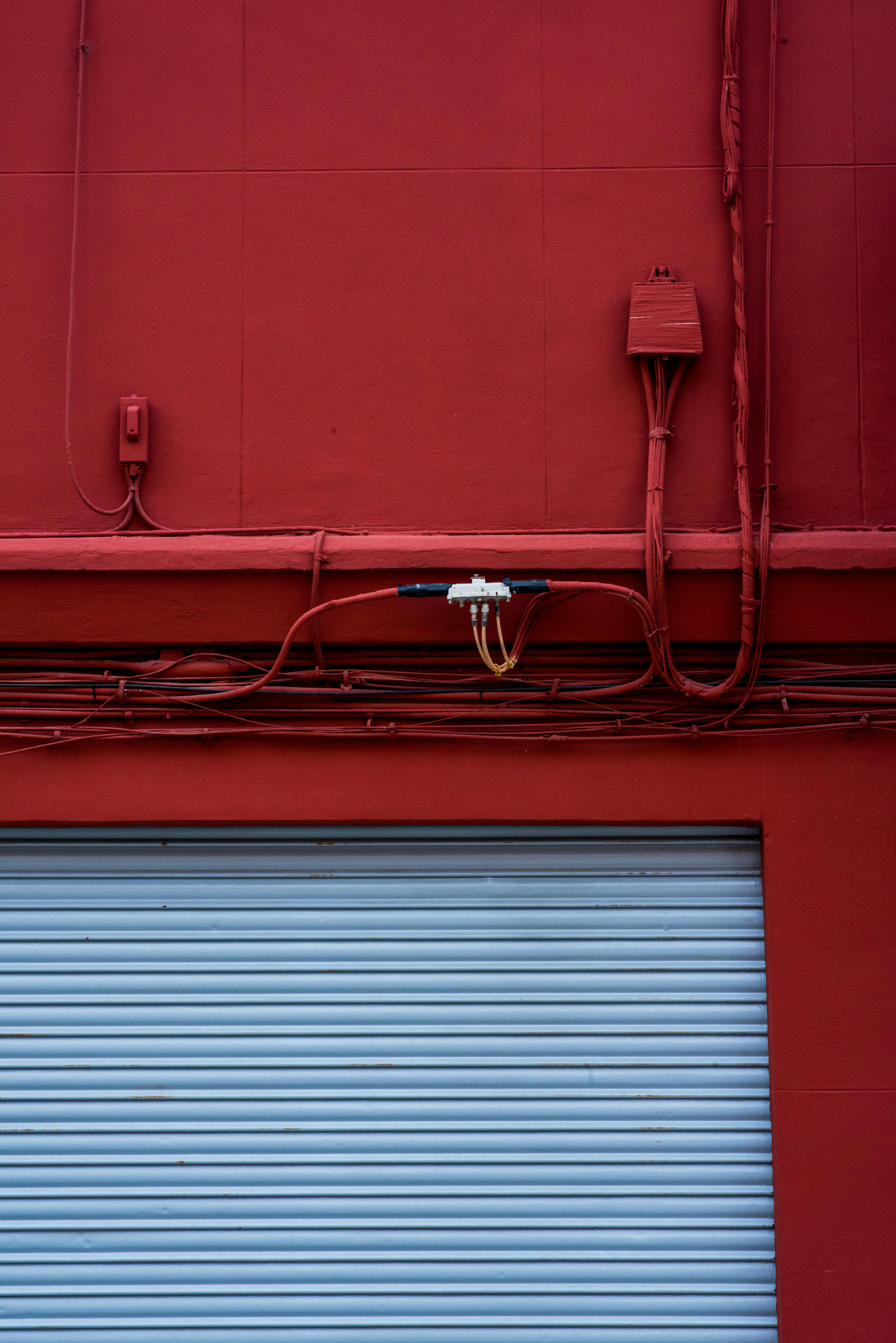 Red Industrial Building with Metal Shutter · Free Stock Photo