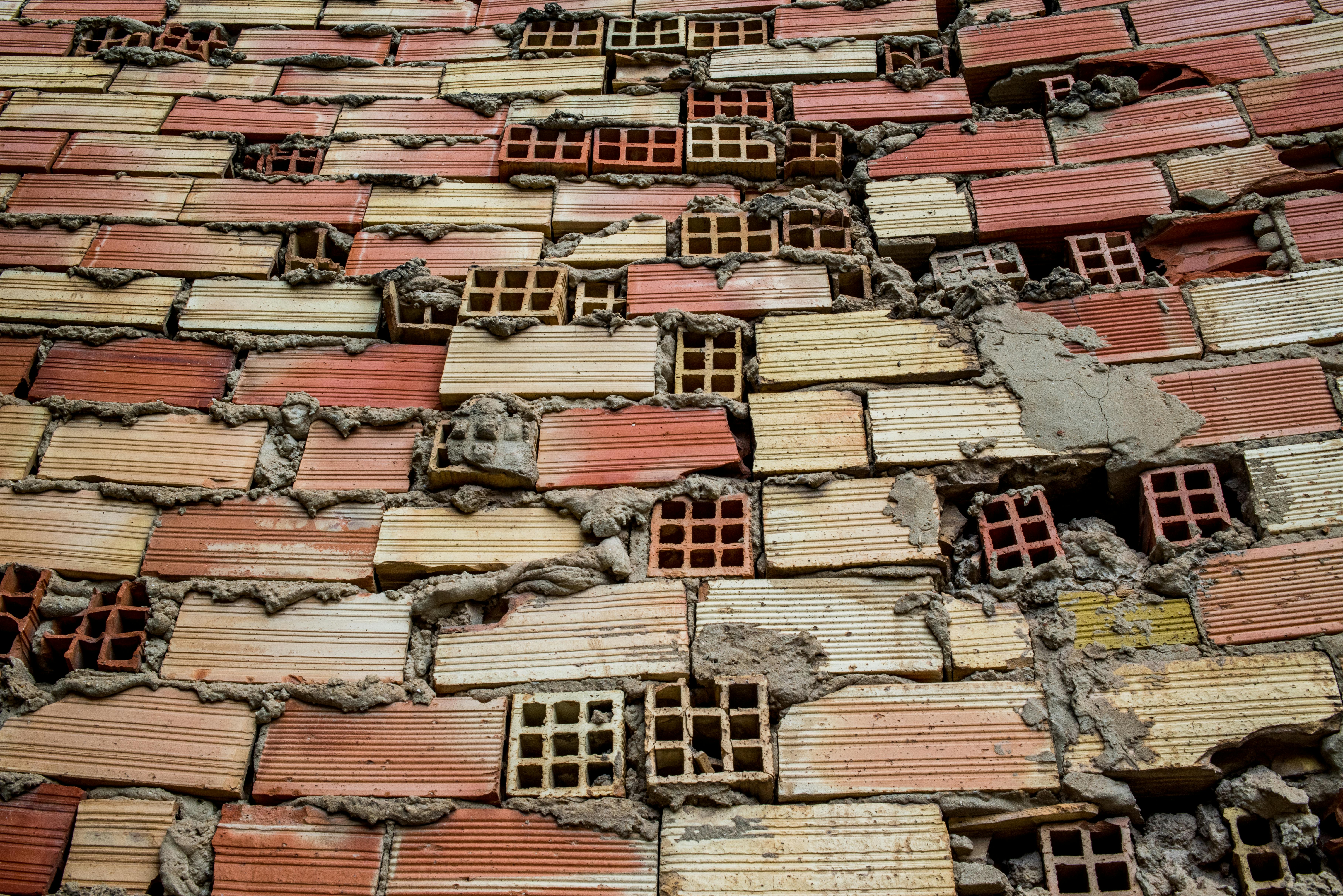 Rustic Brick Wall with Erosion Patterns · Free Stock Photo