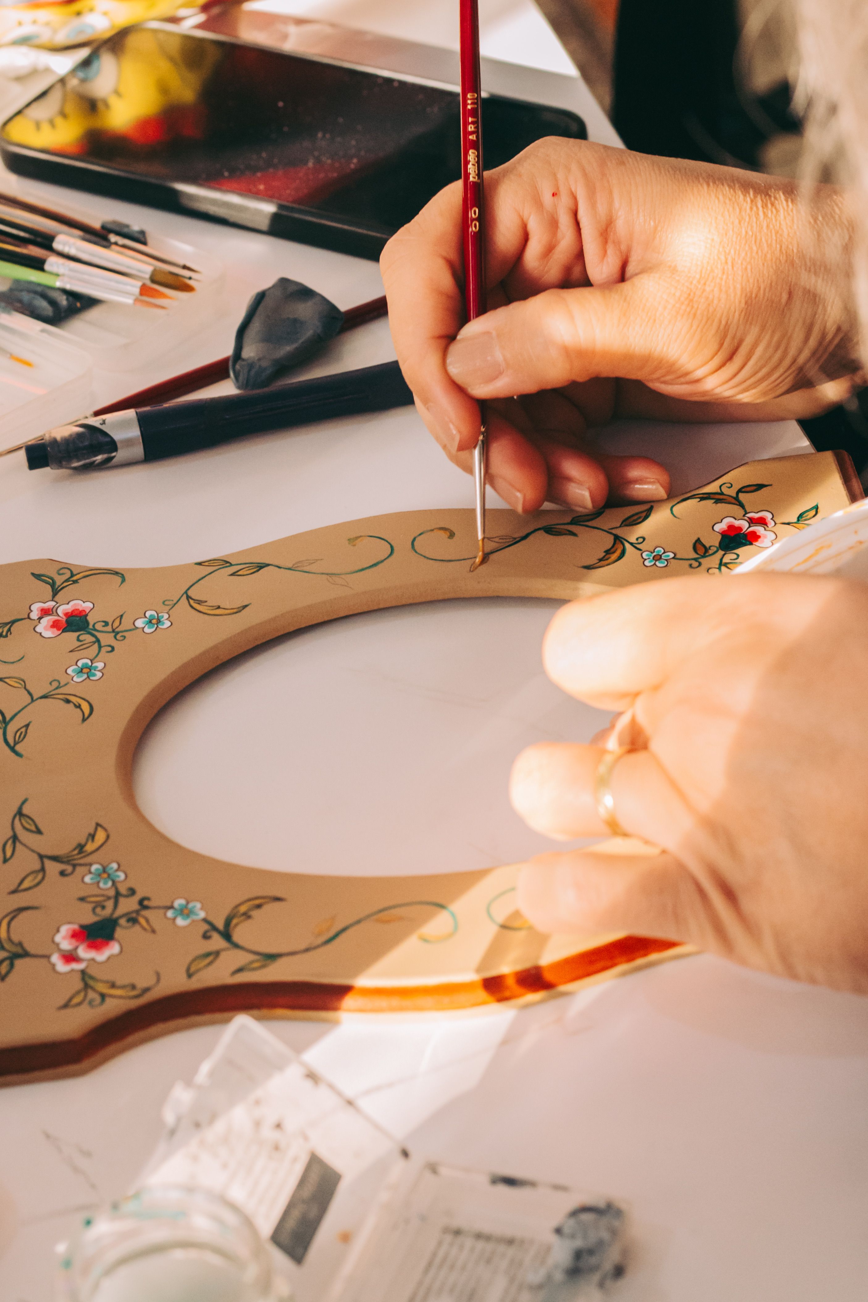 Artistic Hand-Painted Wooden Frame in Sunlight · Free Stock Photo