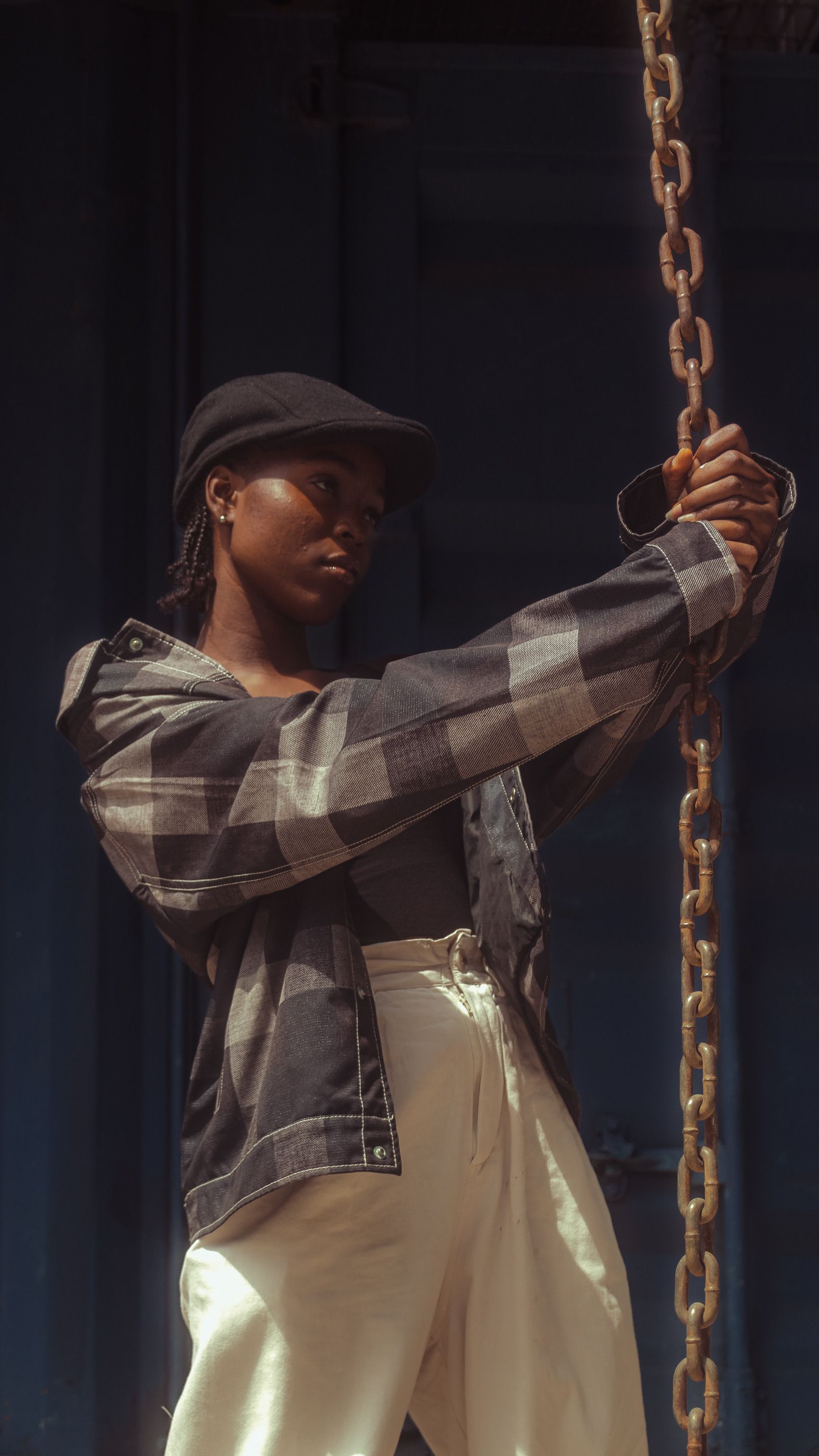 Stylish Woman Holding Chain in Urban Setting · Free Stock Photo