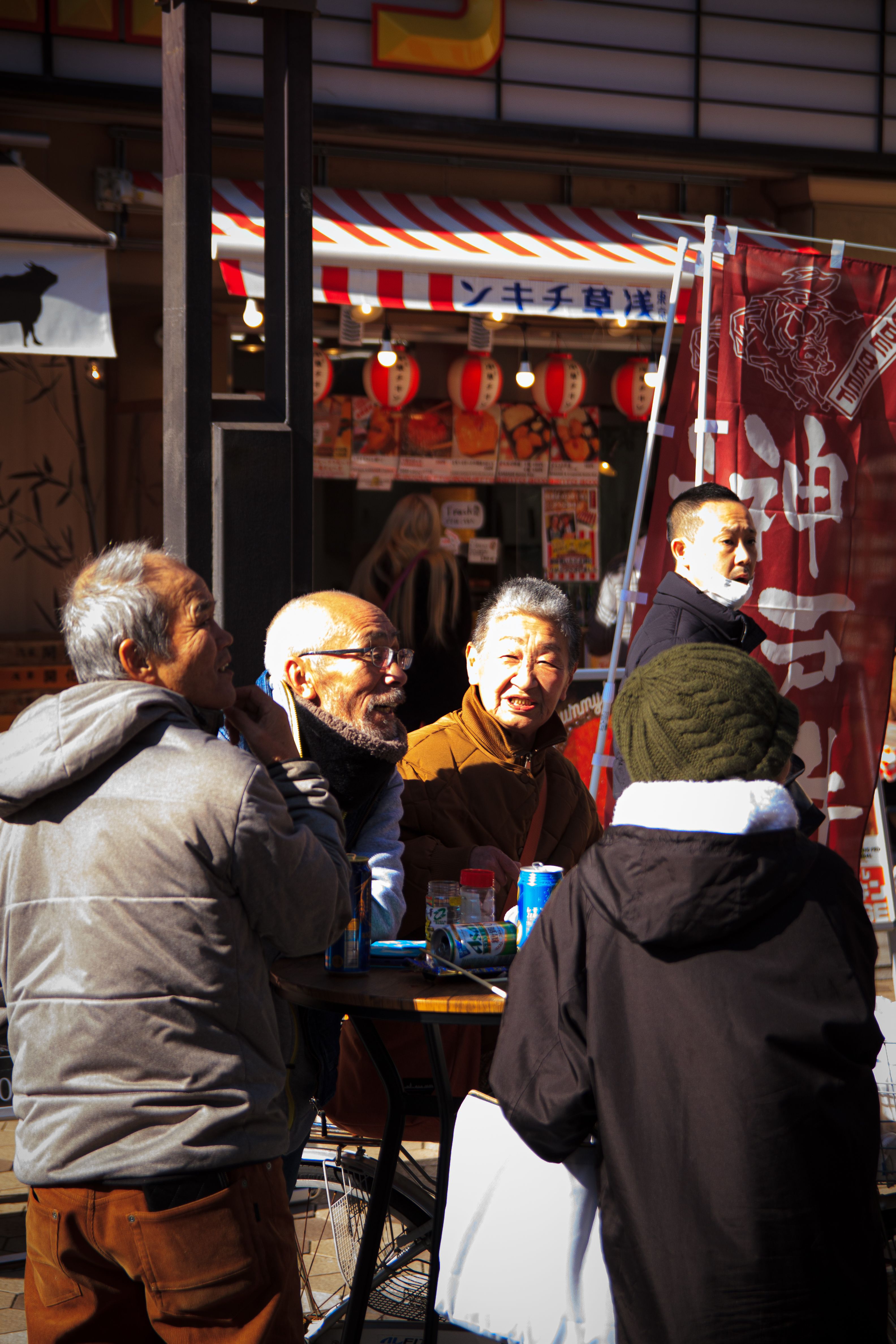 Elderly Group Socializing Outdoors in Urban Setting · Free Stock Photo
