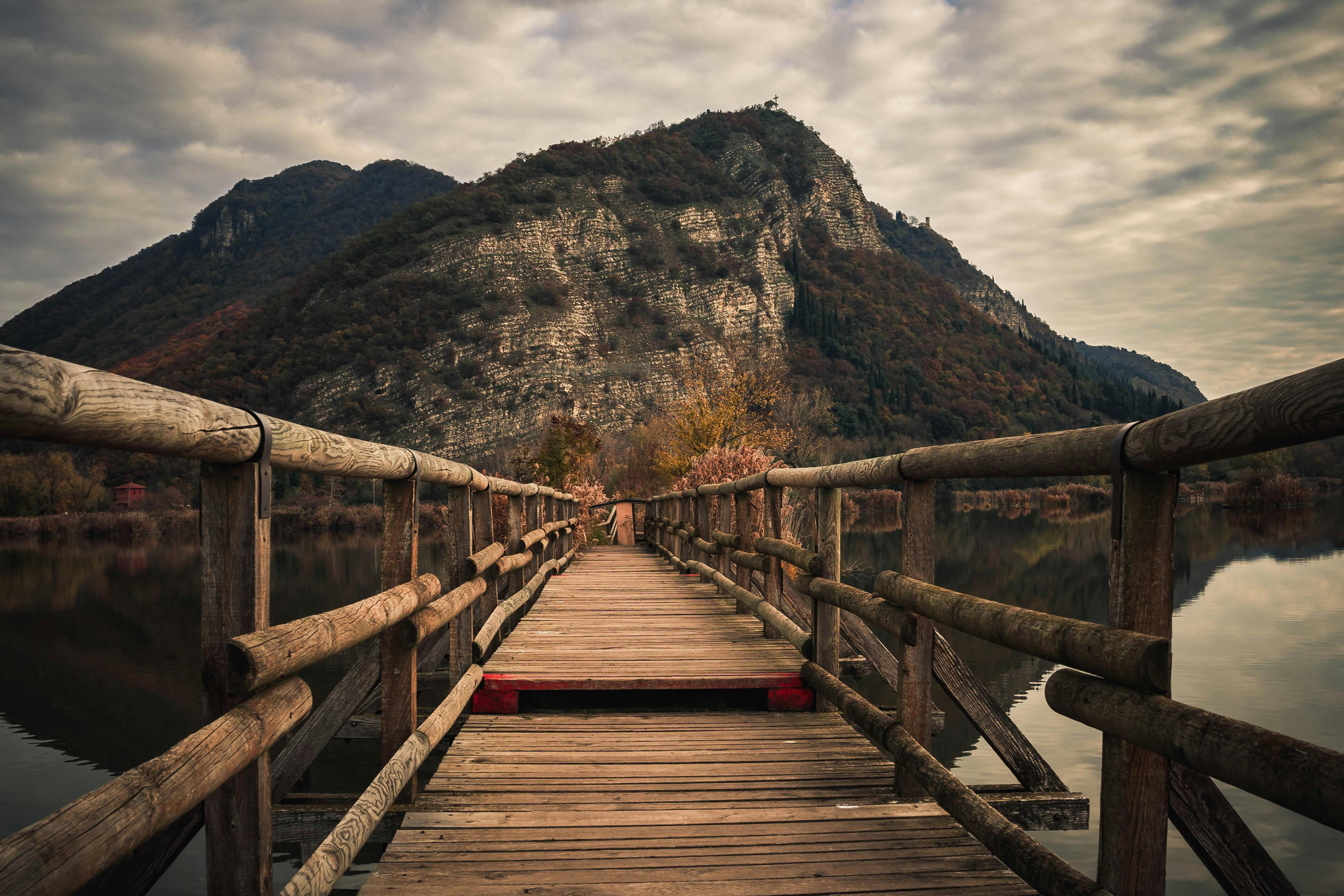 Scenic Lakeside Boardwalk with Mountain View · Free Stock Photo