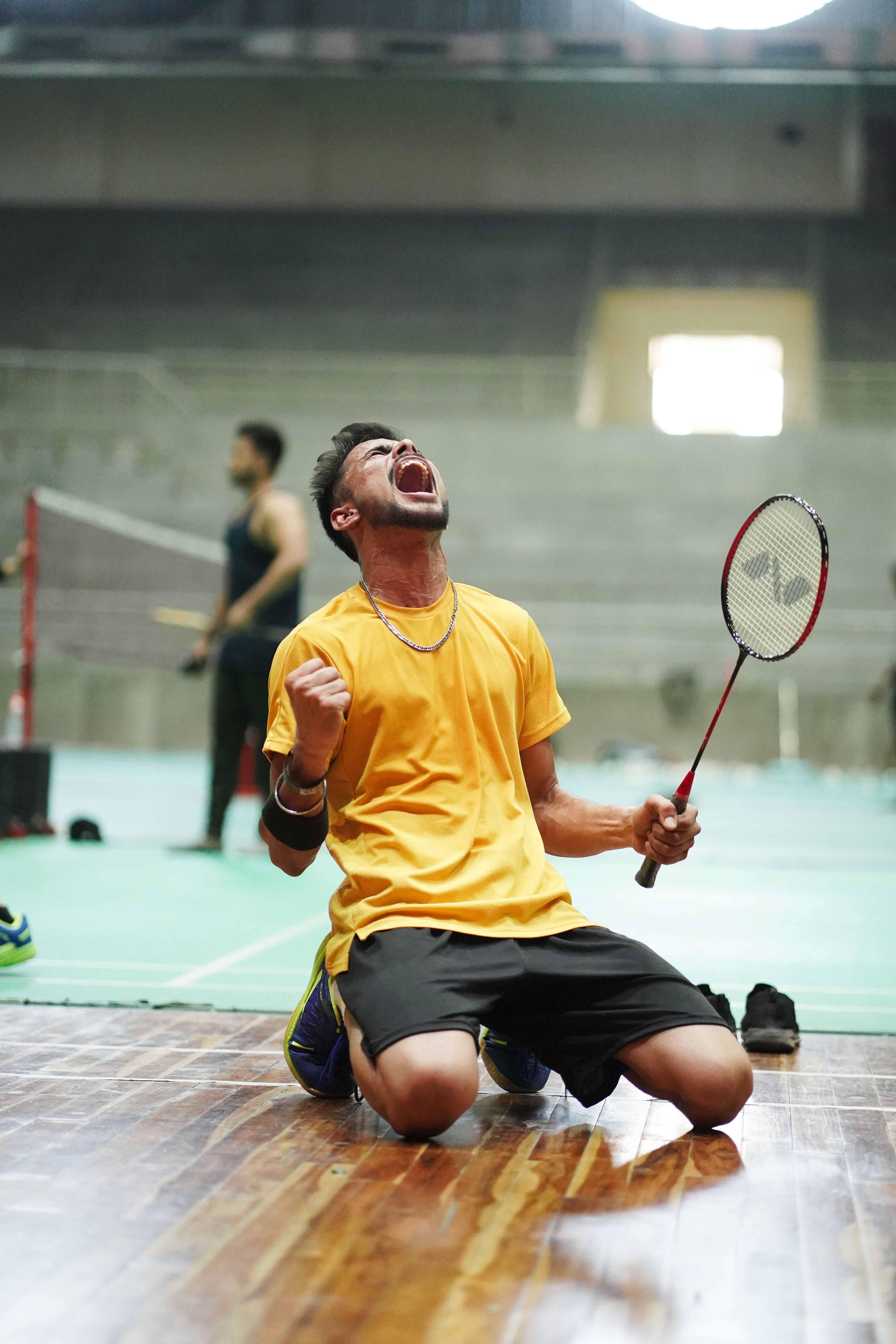 Energetic Badminton Player Celebrating Victory · Free Stock Photo