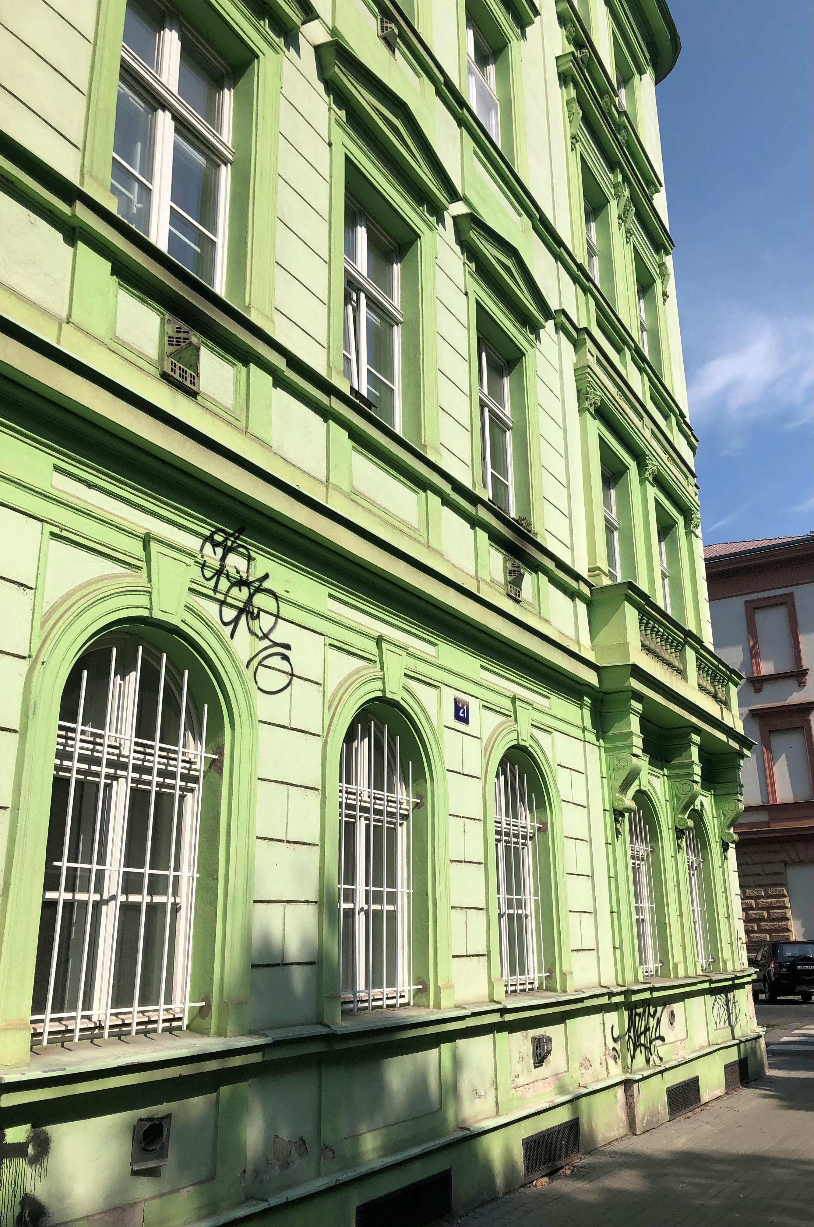 Vintage Green Building in Czech Urban Setting · Free Stock Photo