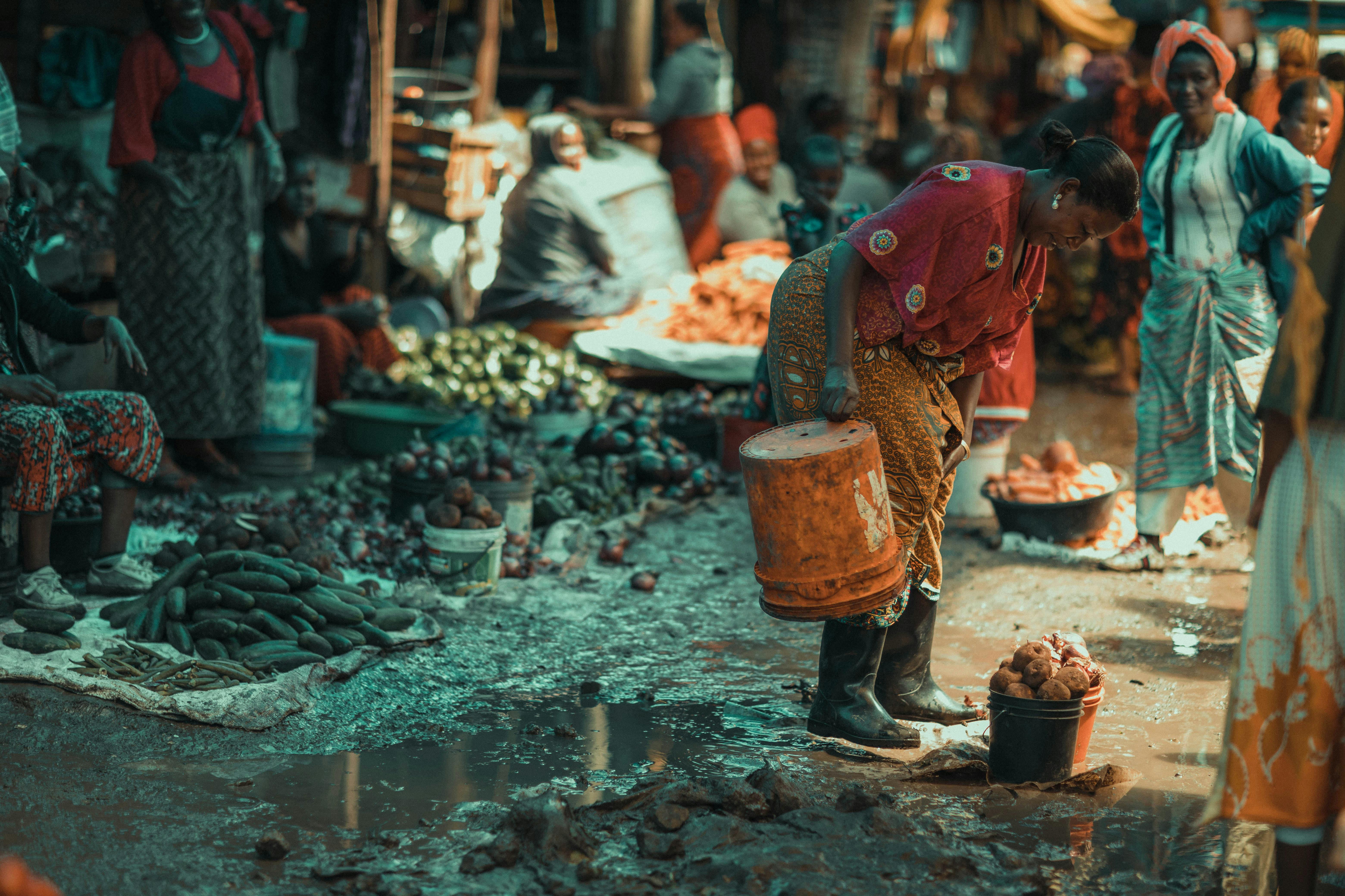 Bustling Local Market Scene with Vegetable Vendors · Free Stock Photo