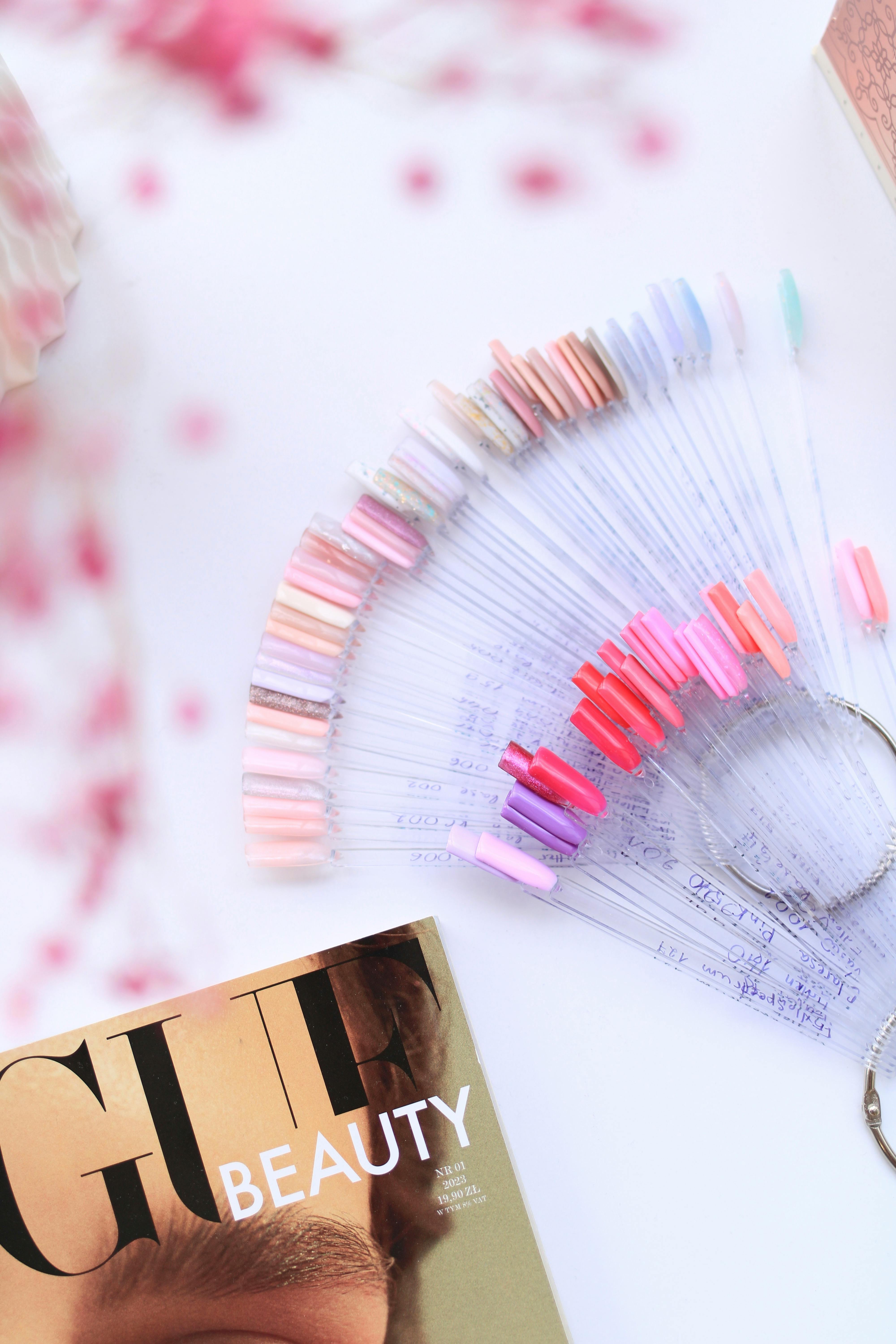 Assorted Nail Polish Palette with Fashion Magazine · Free Stock Photo