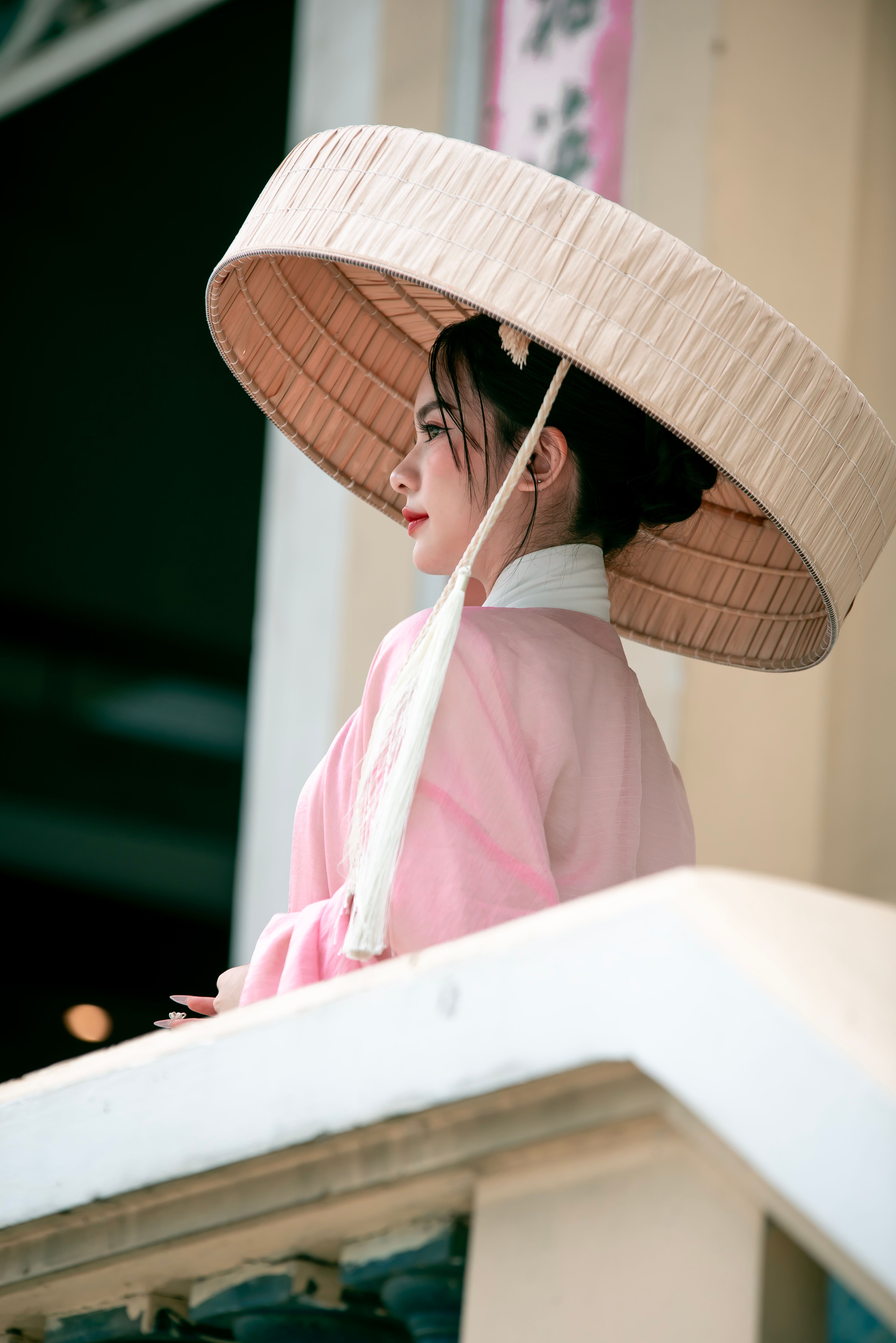 Woman in Traditional Asian Attire with Large Hat · Free Stock Photo