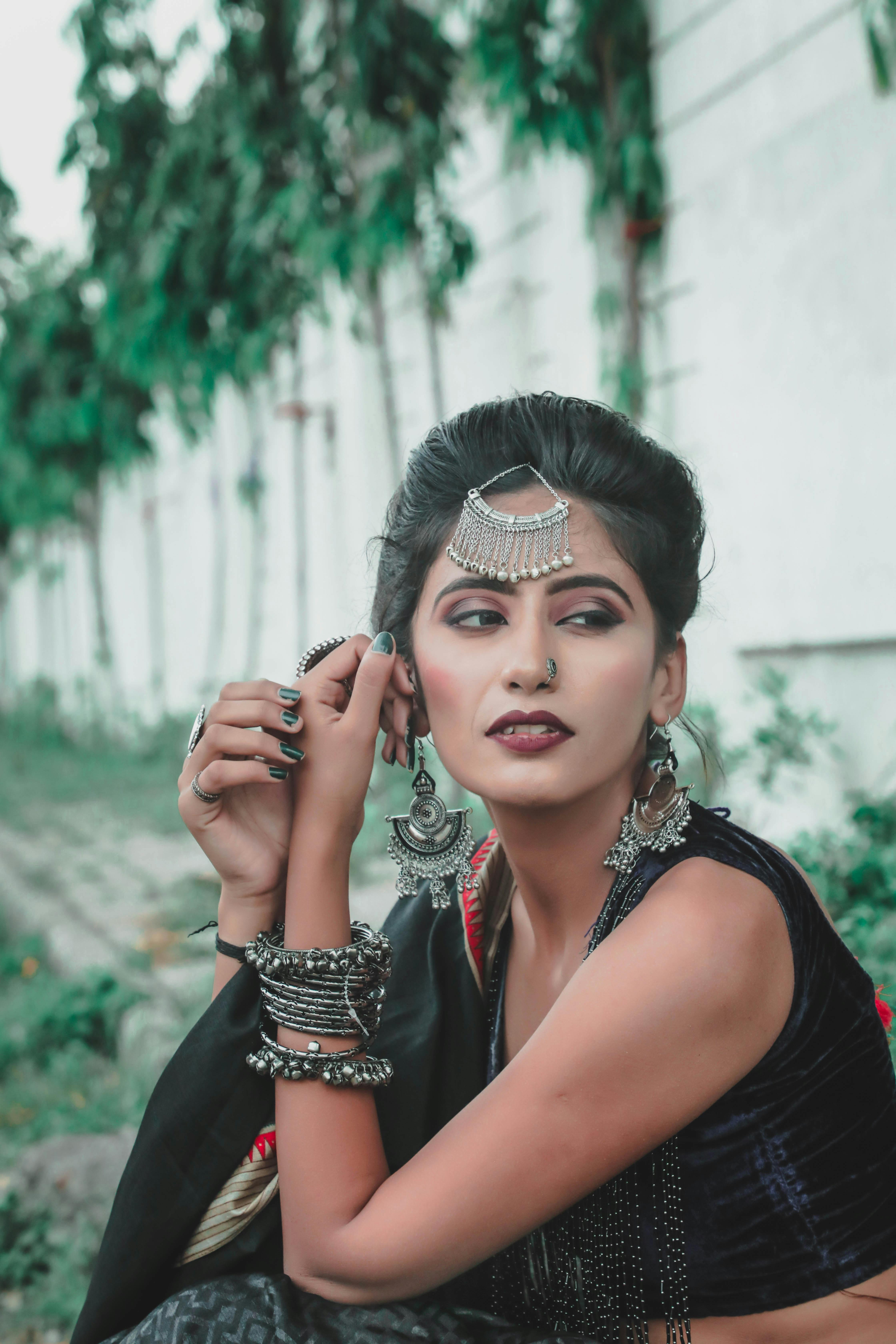 Back View of a Woman Modeling in an Oversized T Shirt · Free Stock Photo