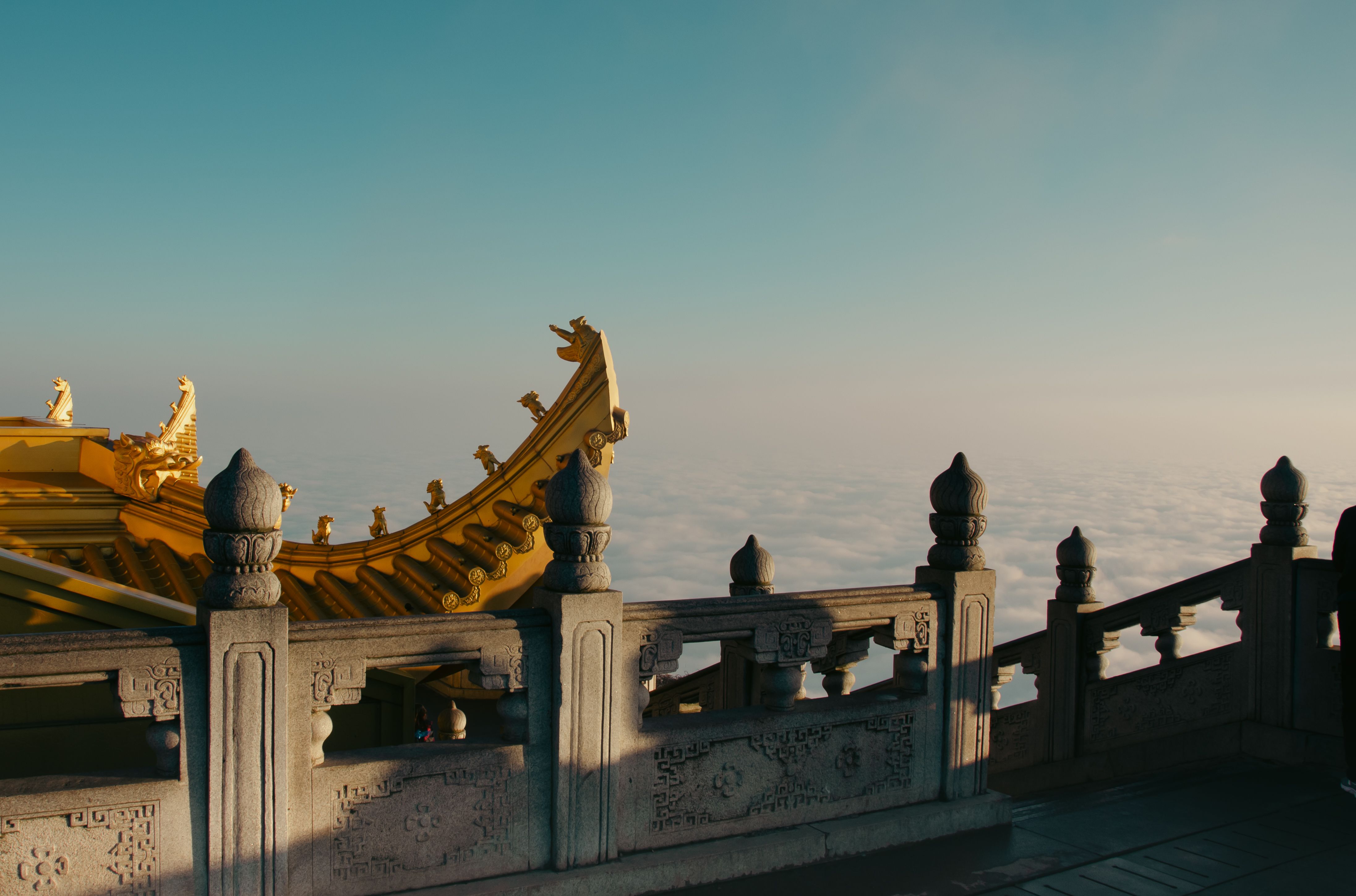 Traditional Temple Rooftop Above the Clouds · Free Stock Photo
