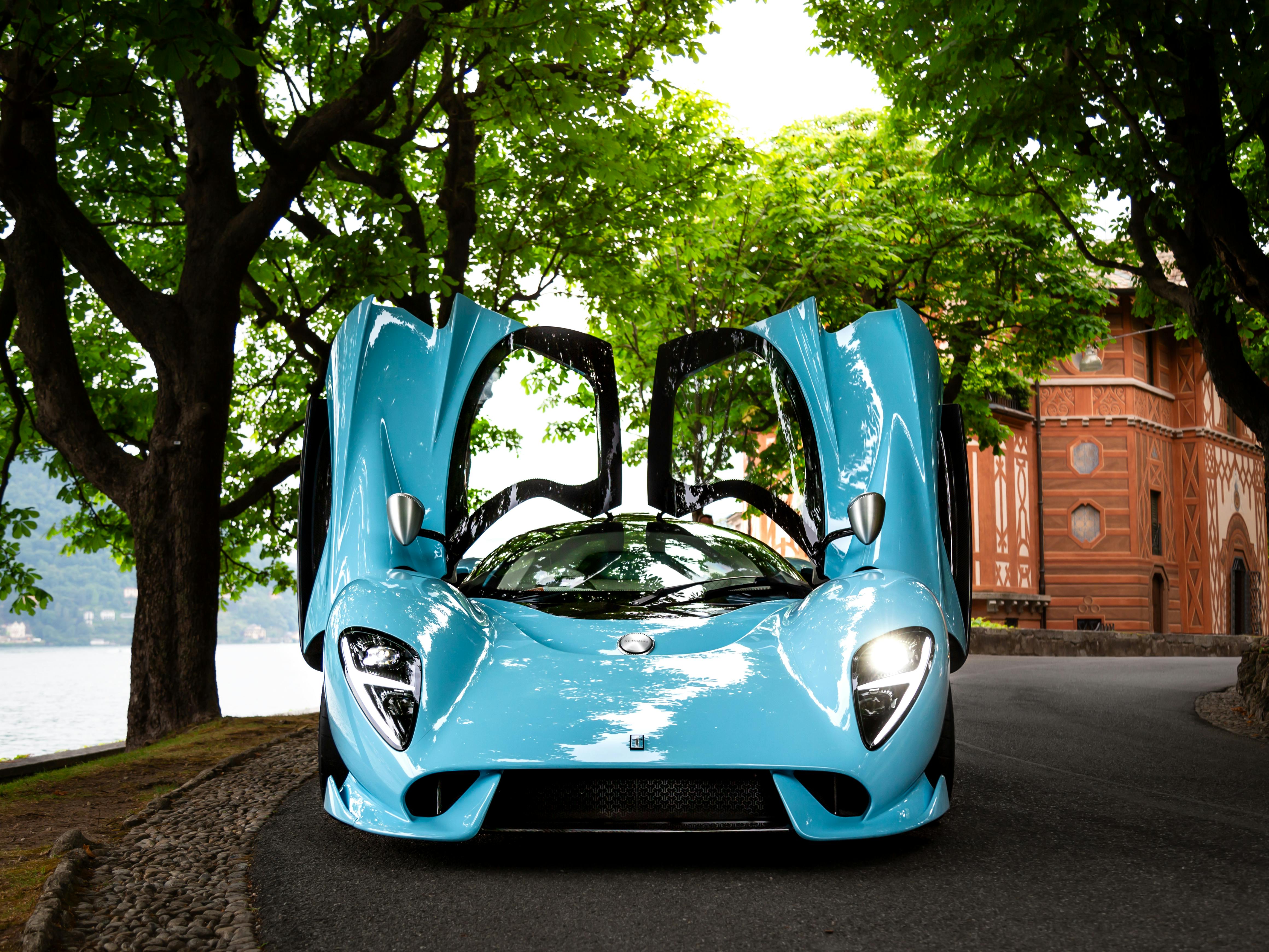 Stunning Blue Sports Car with Open Scissor Doors in Nature · Free Stock ...