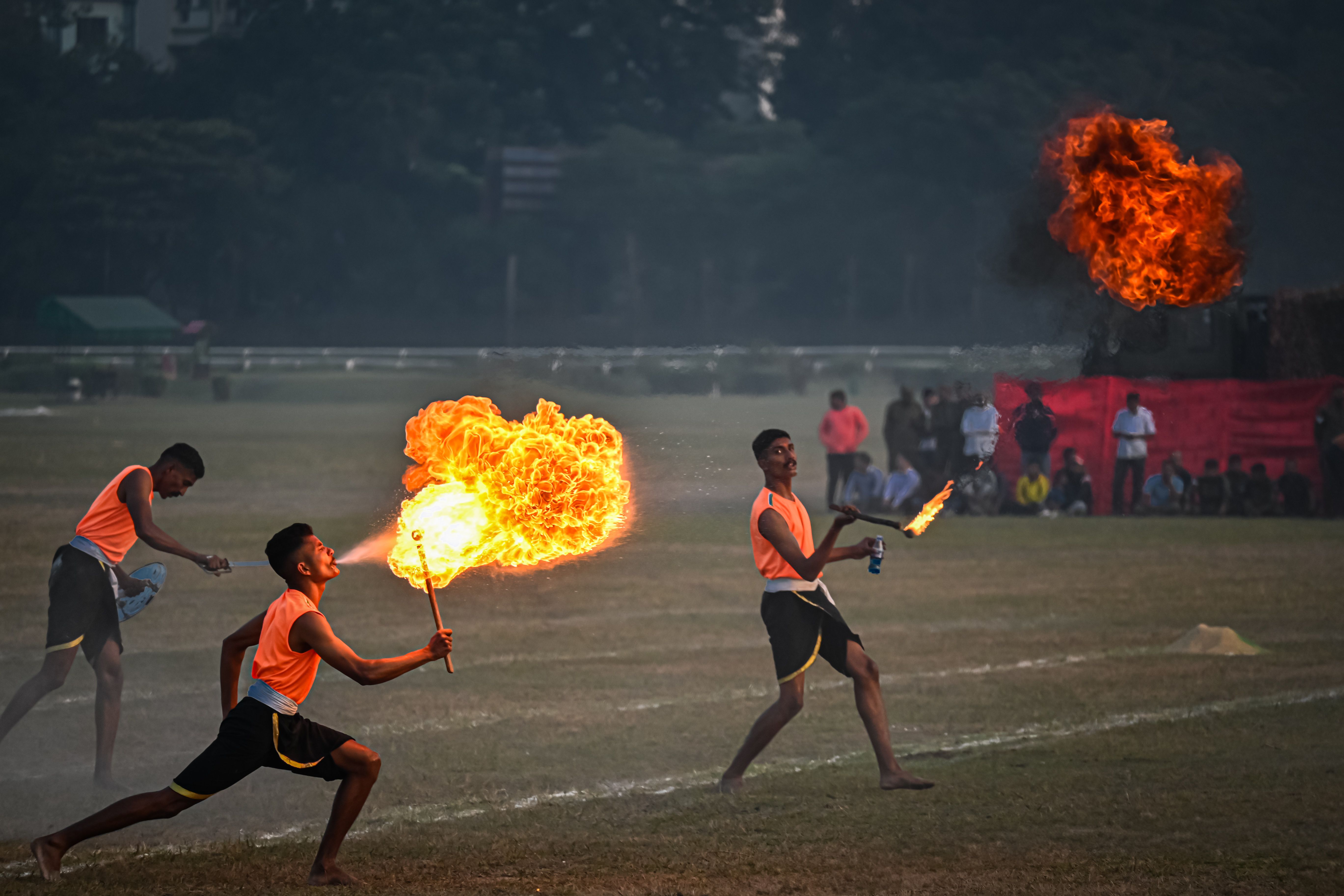 Young Fire Breathers Performing Outdoors · Free Stock Photo
