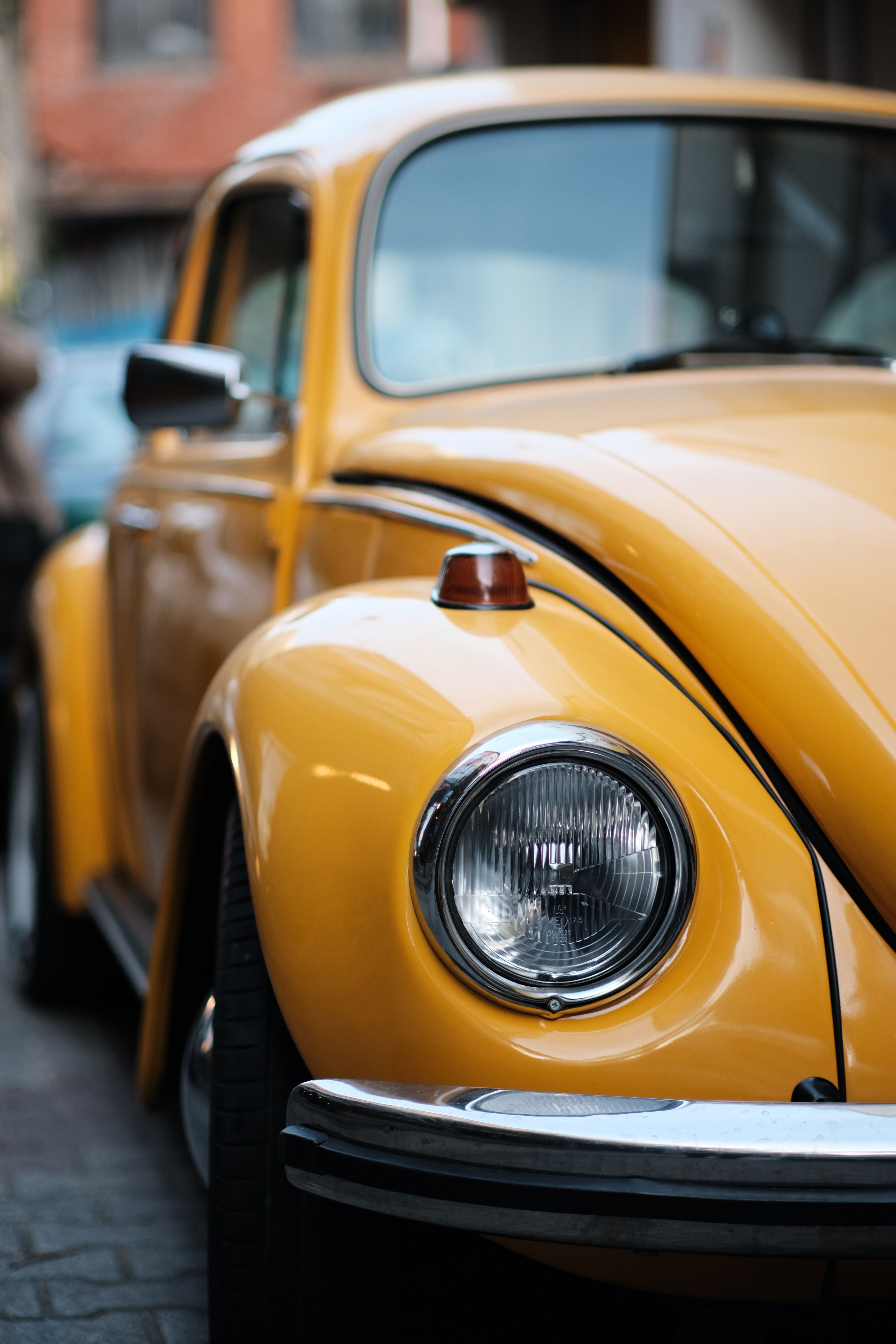 Close-Up of Vintage Yellow Car on Street · Free Stock Photo