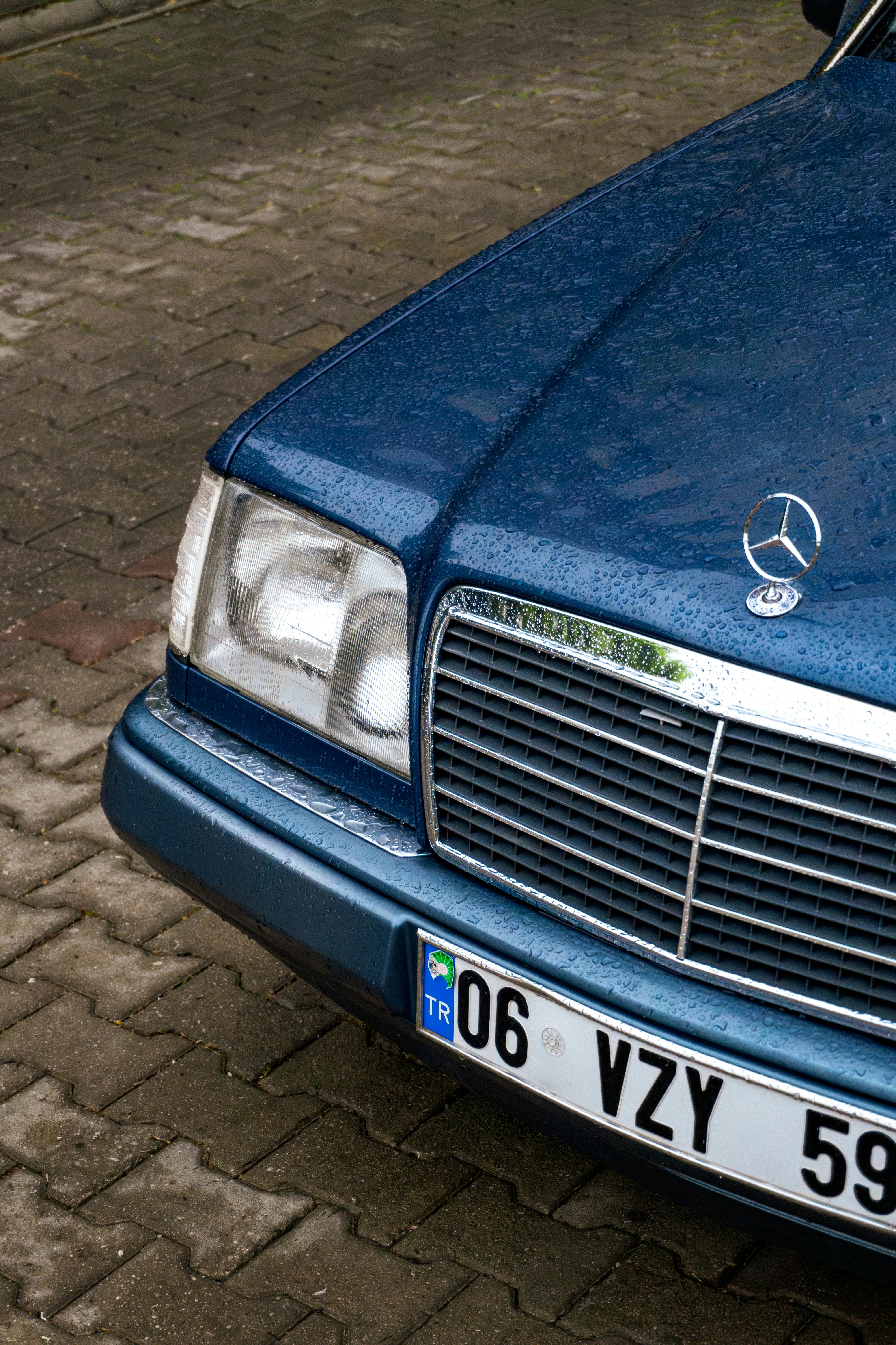 Classic Blue Car with Raindrop Accents · Free Stock Photo