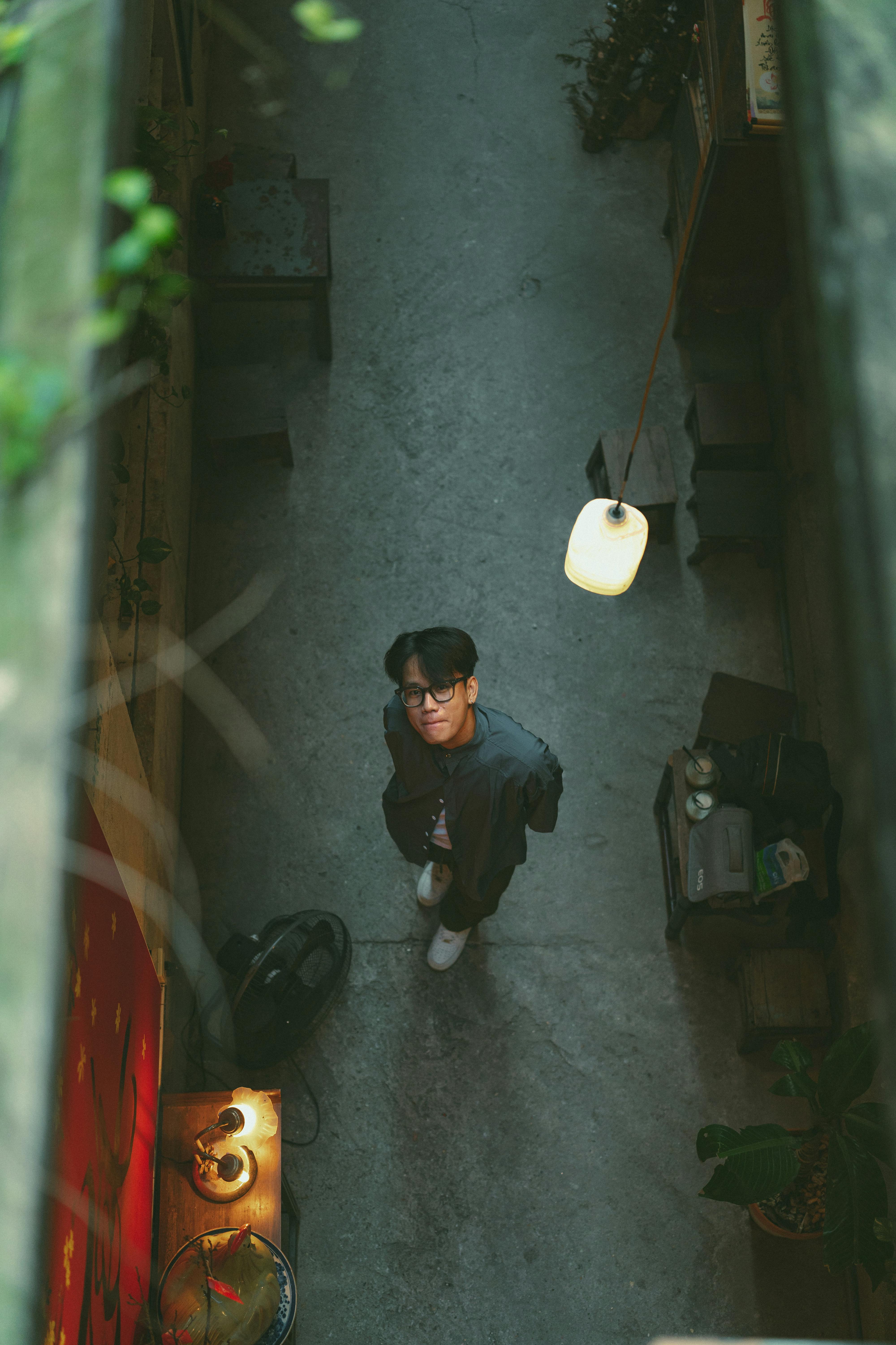 Top-Down View of Person in Ho Chi Minh City Alleyway · Free Stock Photo