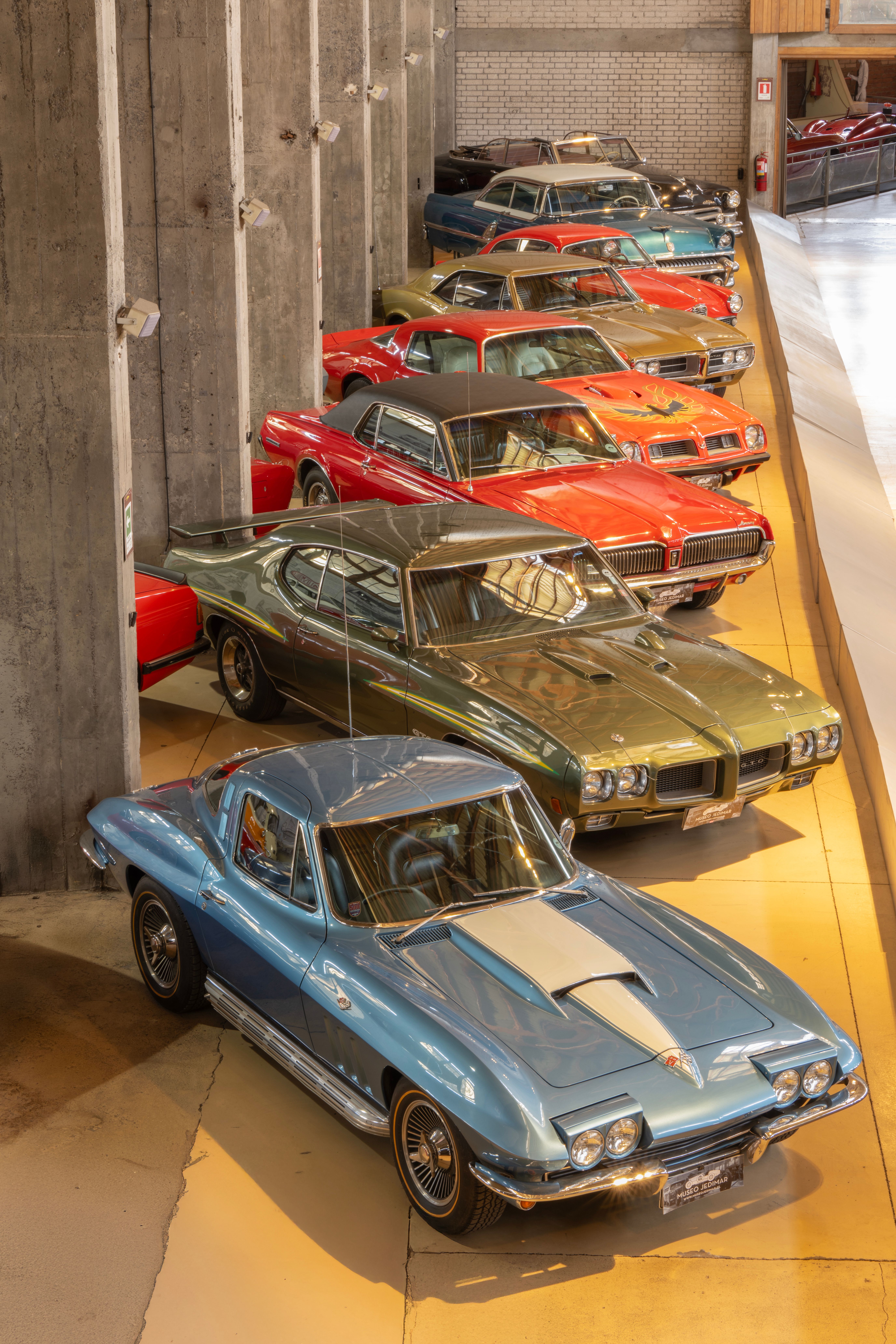 Vintage Classic Cars in Showroom Display · Free Stock Photo