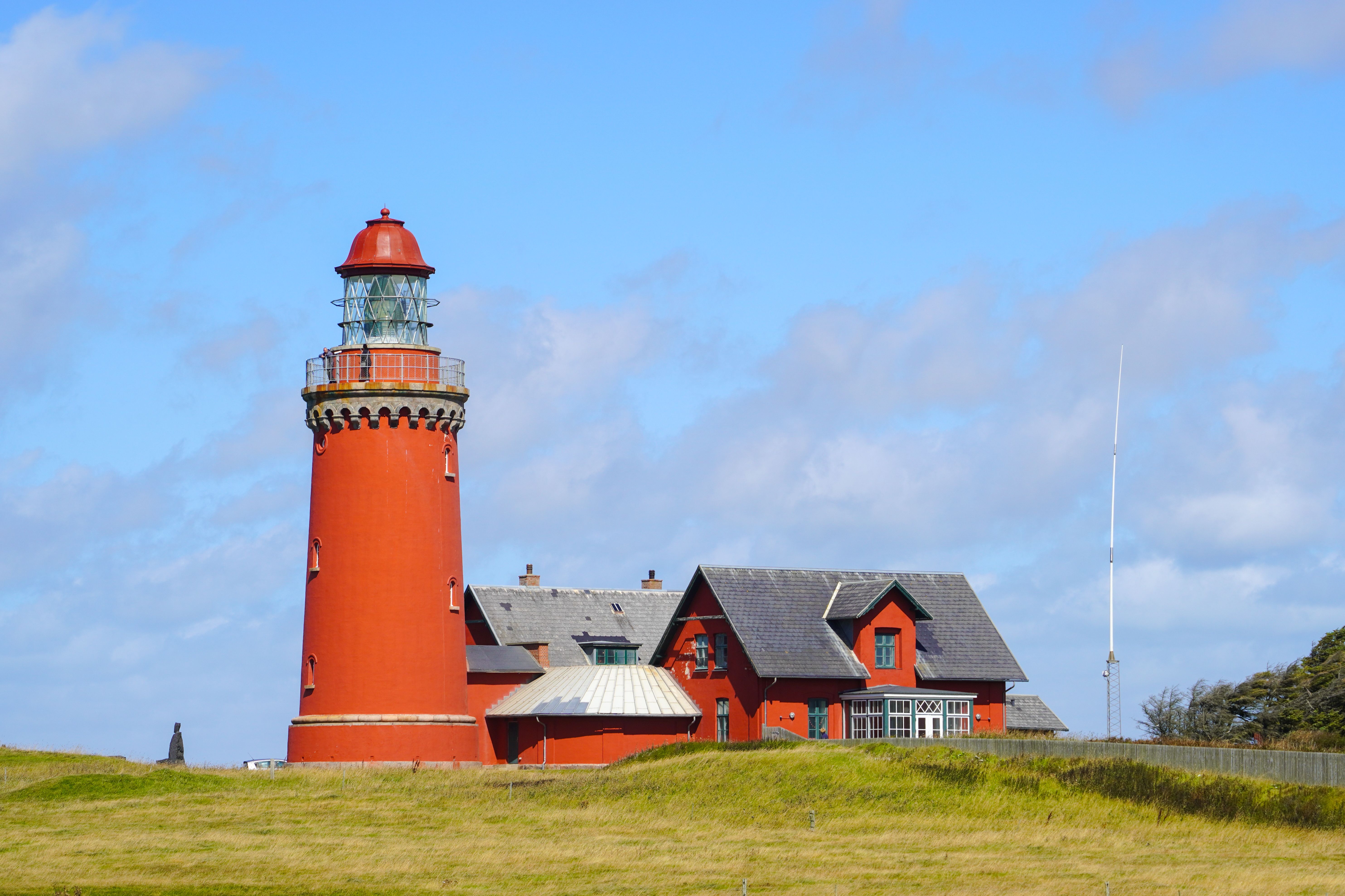 Red Lighthouse and Building in Lemvig, Denmark · Free Stock Photo