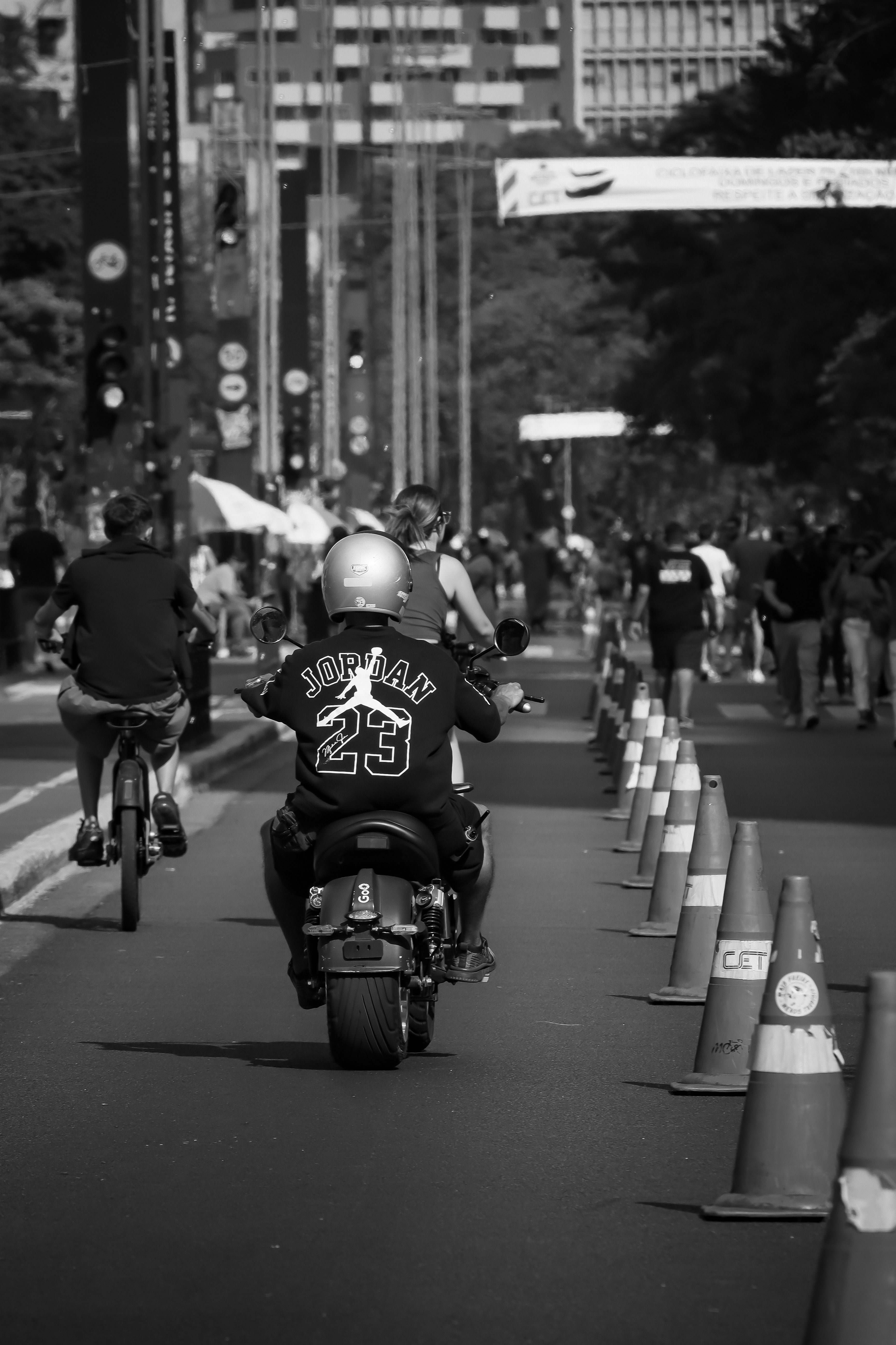 Street Scene with Motorcyclist and Urban Crowd · Free Stock Photo